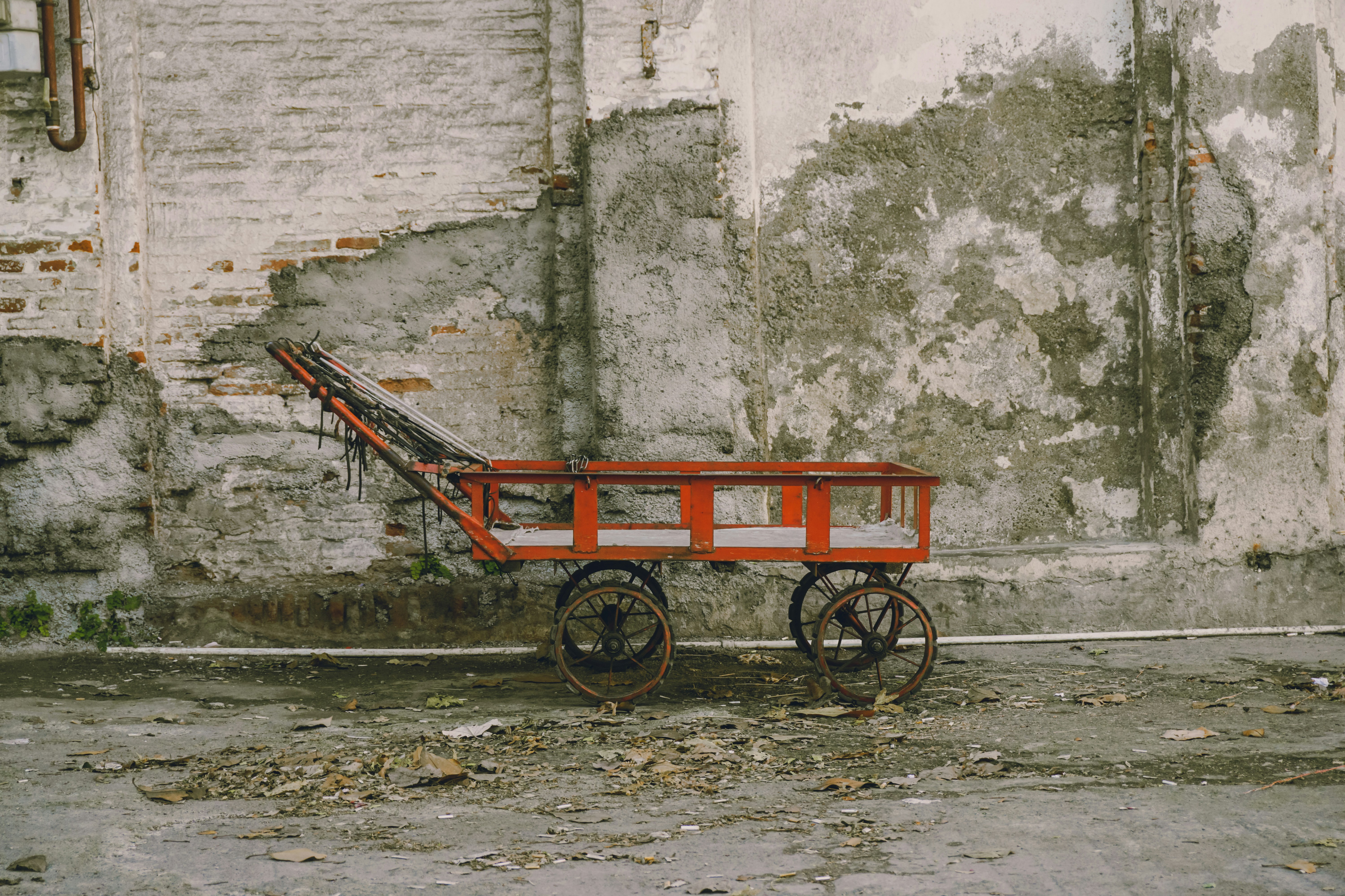 Aged Red Wagon on a Quiet Alley Stage