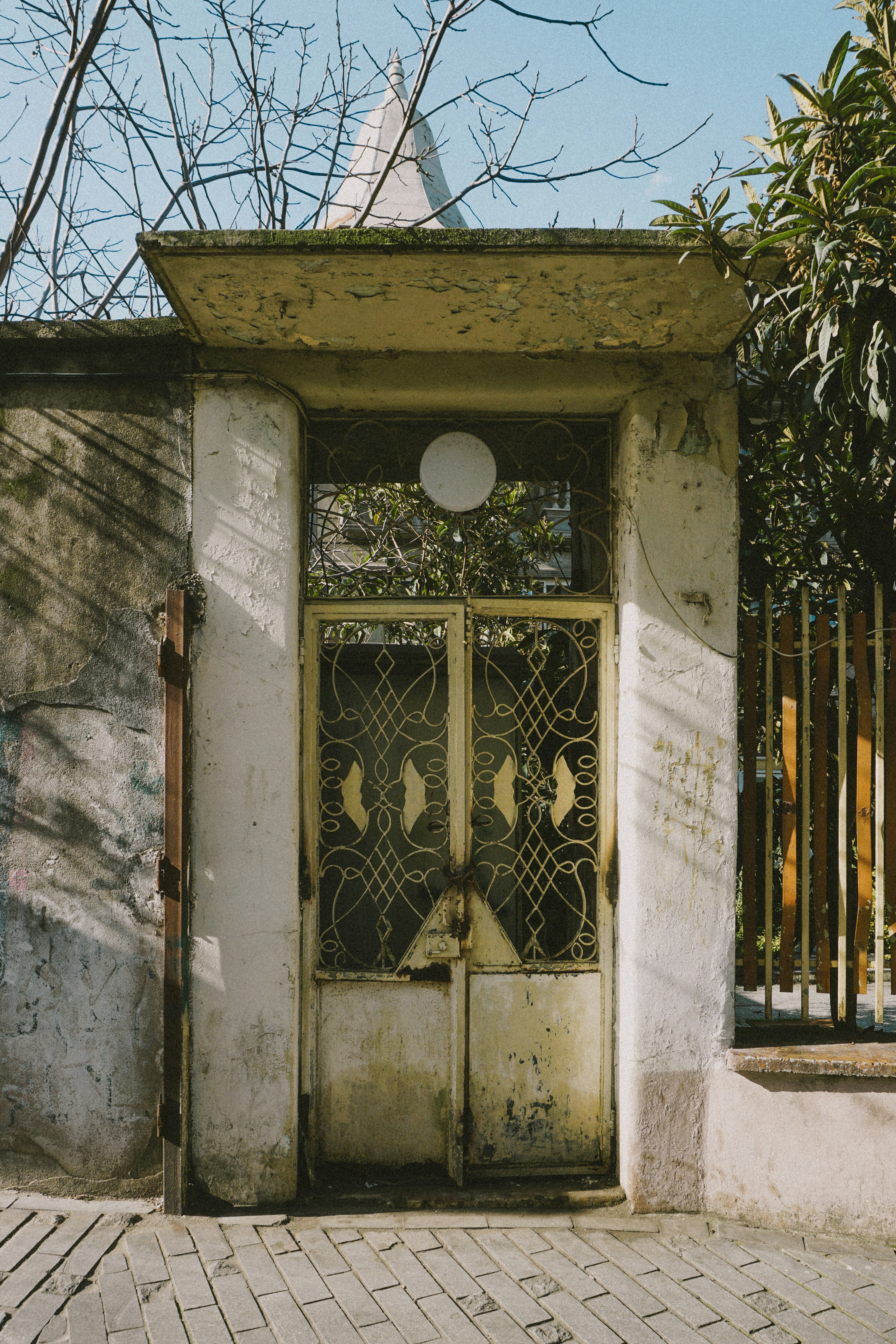 A Weathered Gateway: Quiet Gatefront of Timeworn Ironwork