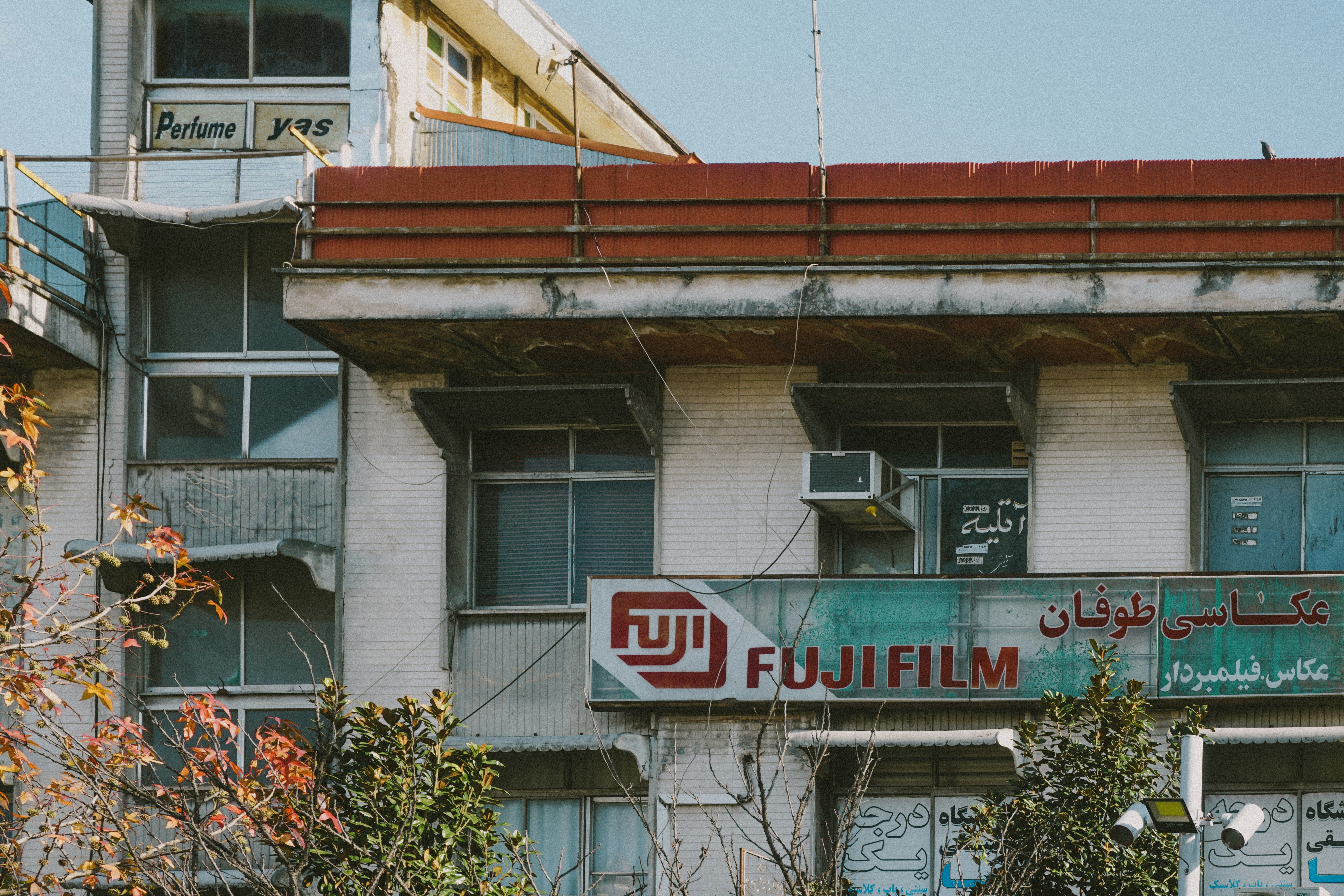 Faded Signage Over a Quiet Facade