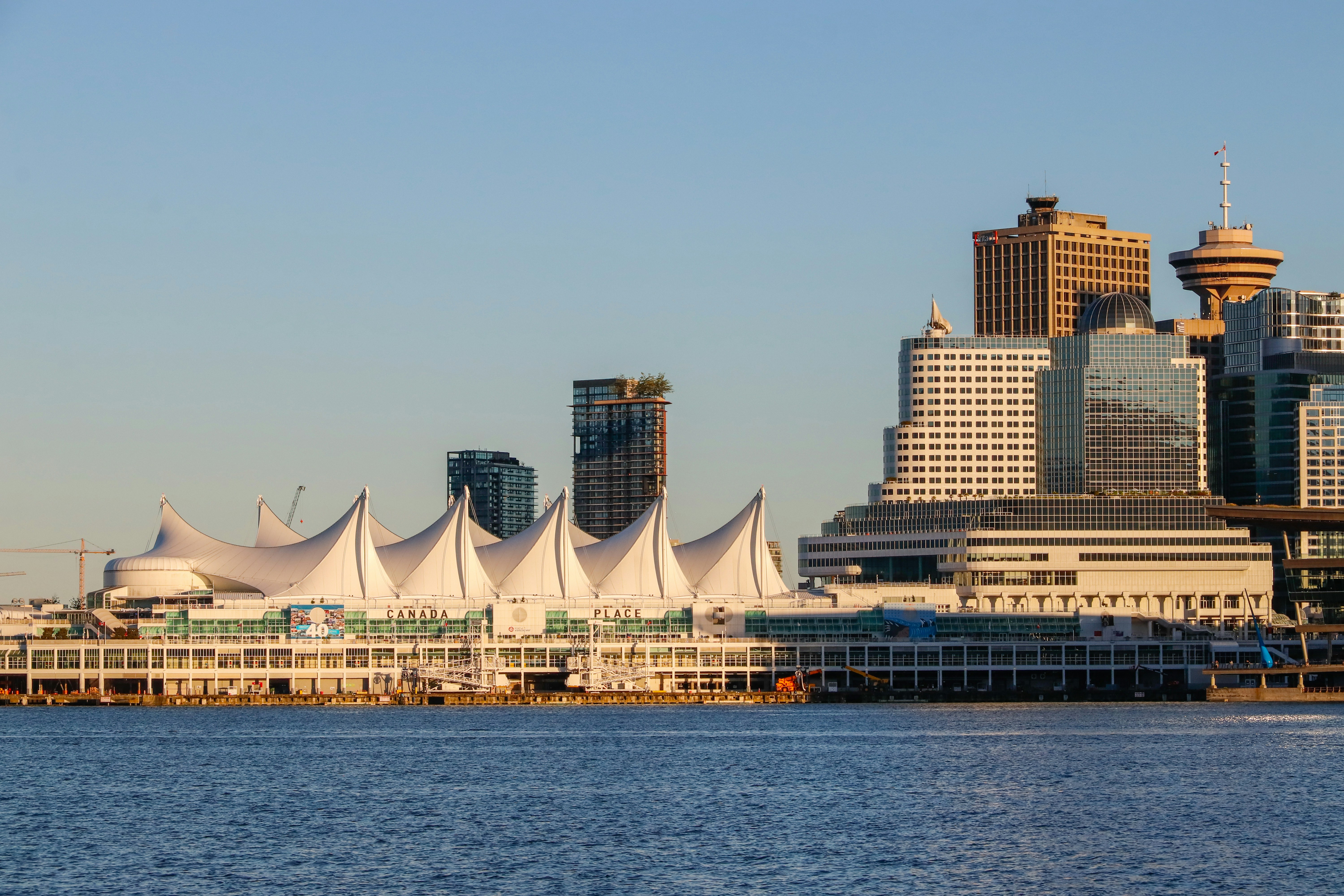 Harbor Silhouette: Pier, Tented Roofs, and Skyline