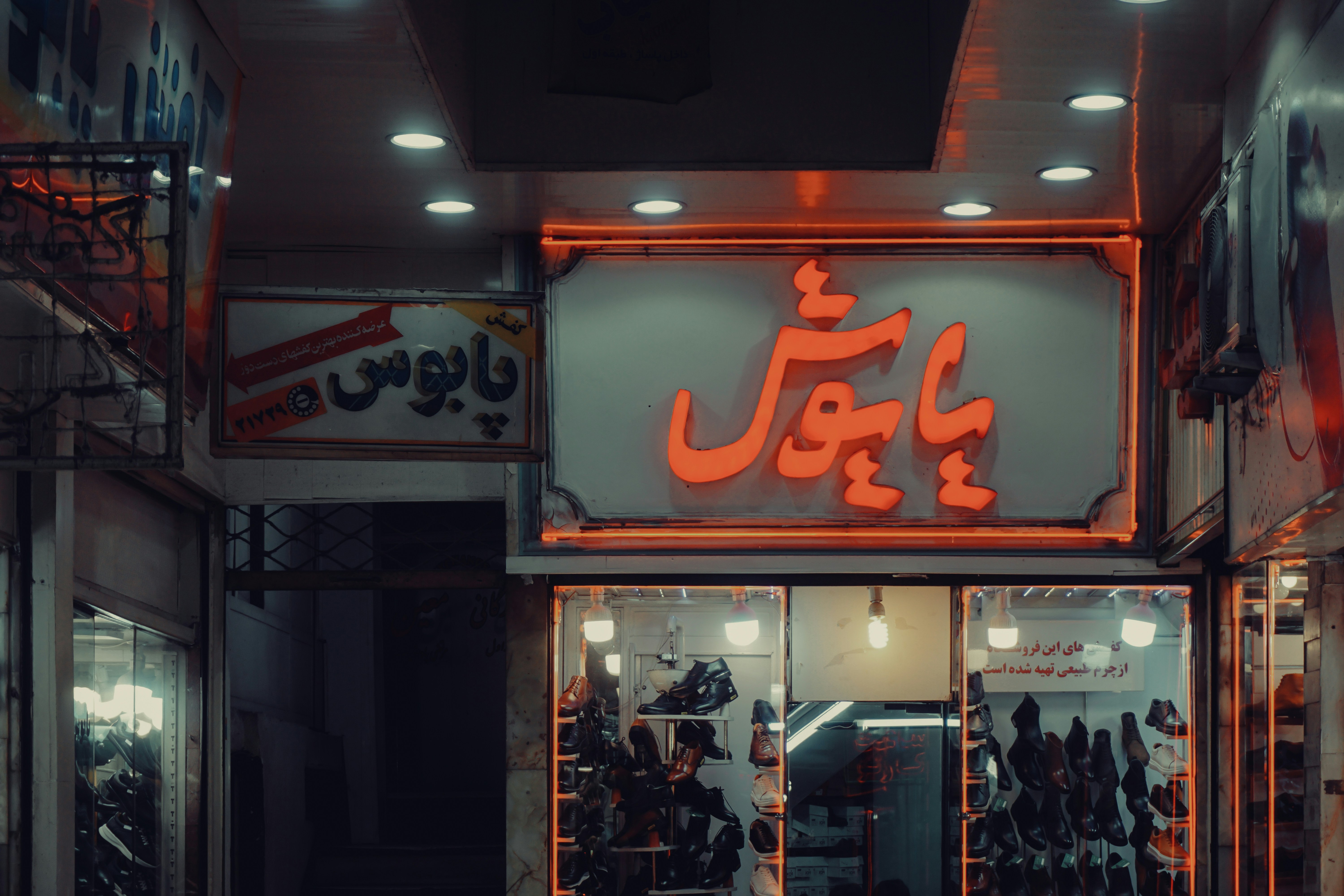 Neon Signage and Footfall in a Dimly Lit Bazaar