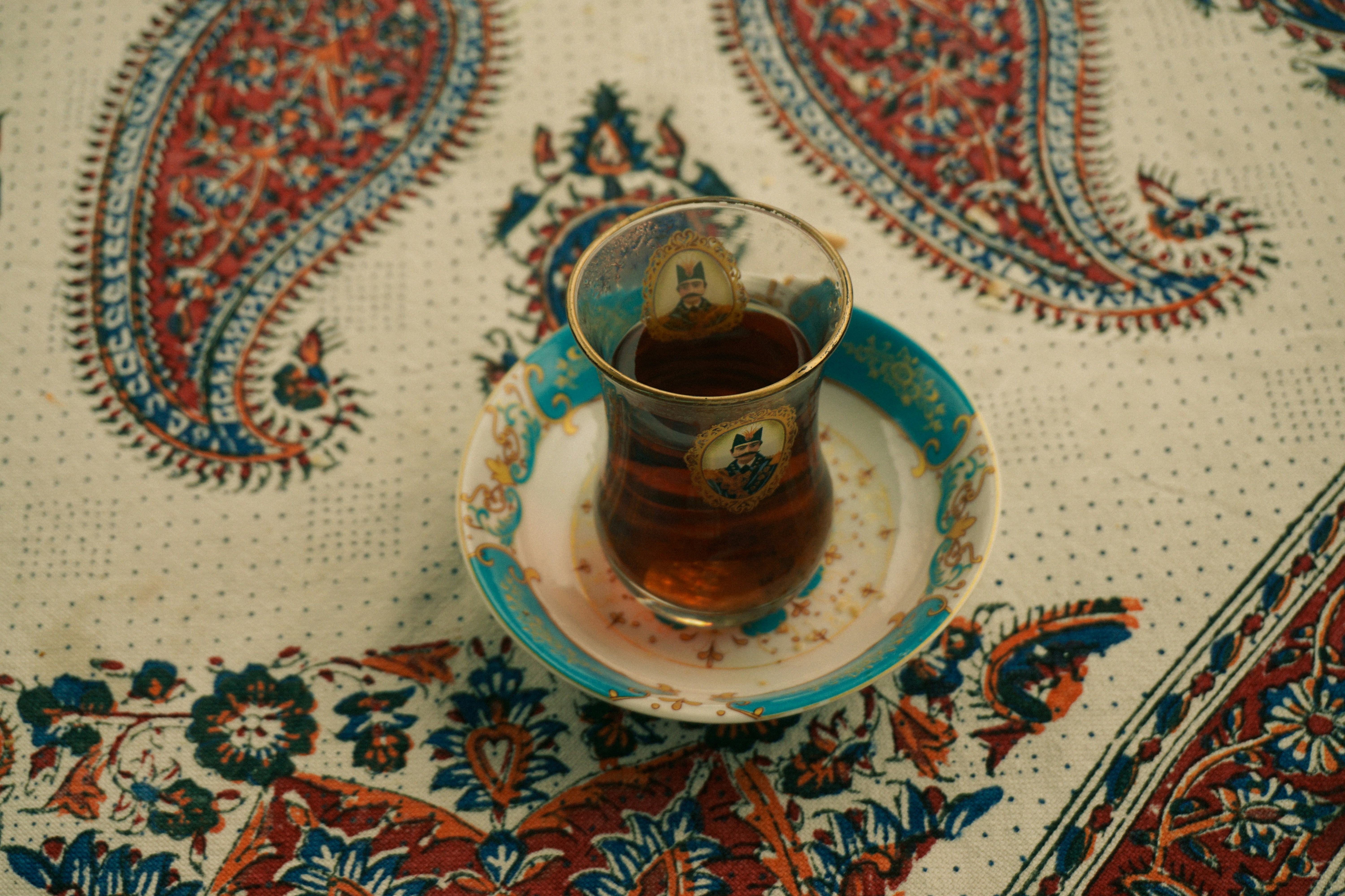 Tea in a Turkish Glass: A Decorative Moment on Patterned Cloth