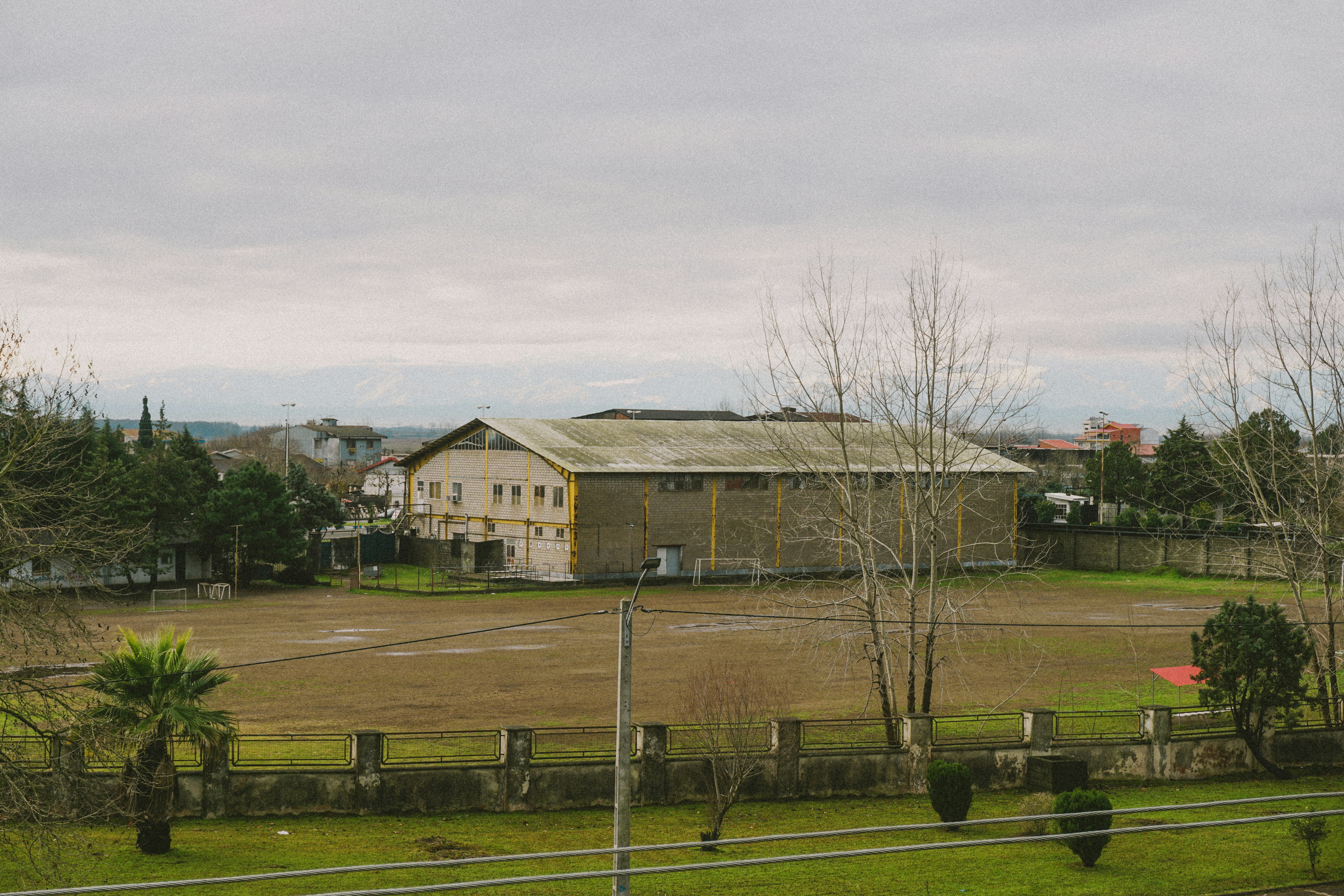 Muted Horizons Over an Aged Farmyard