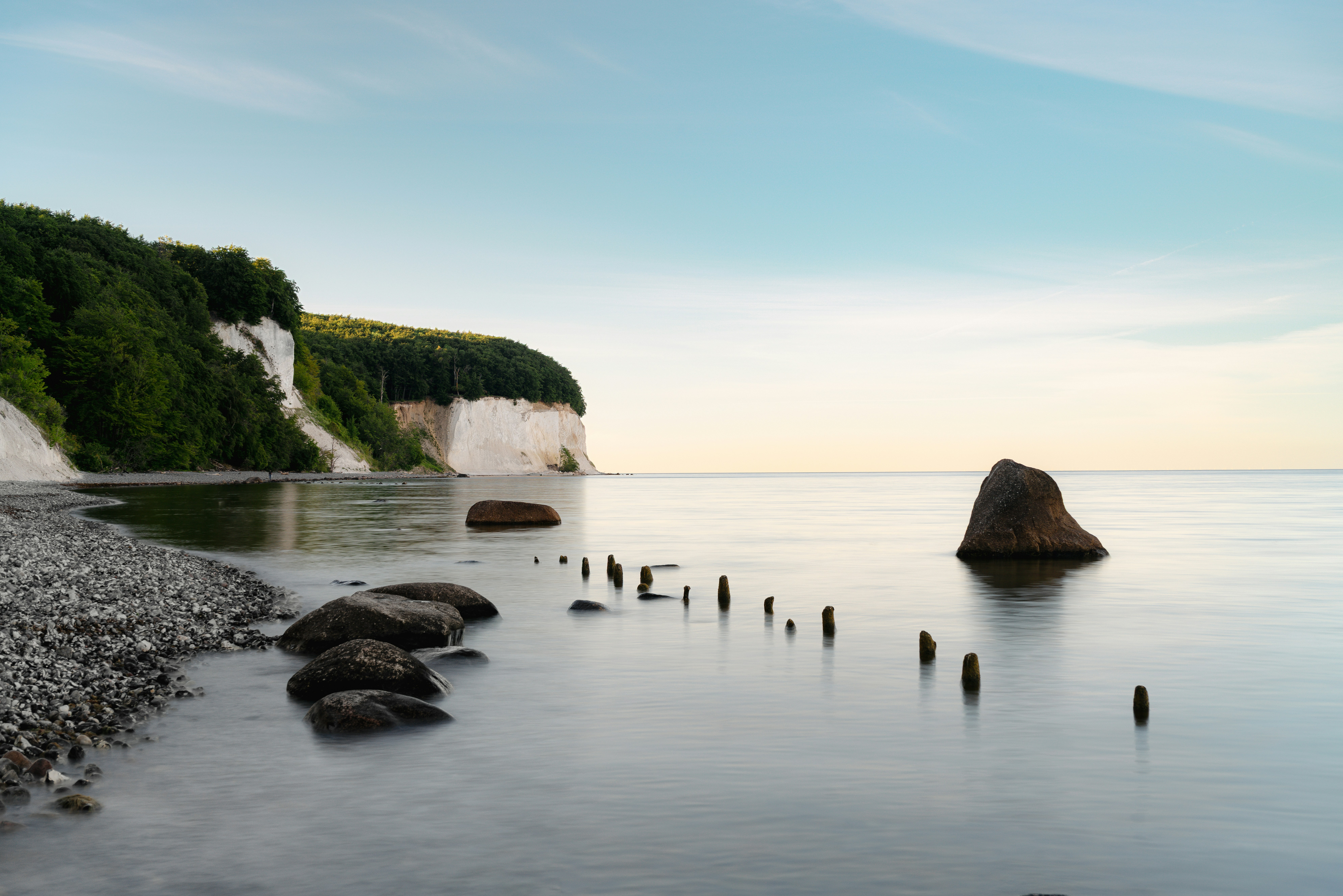 Vertical Rock Sentinel Reaching into a Glassy Evening Sea