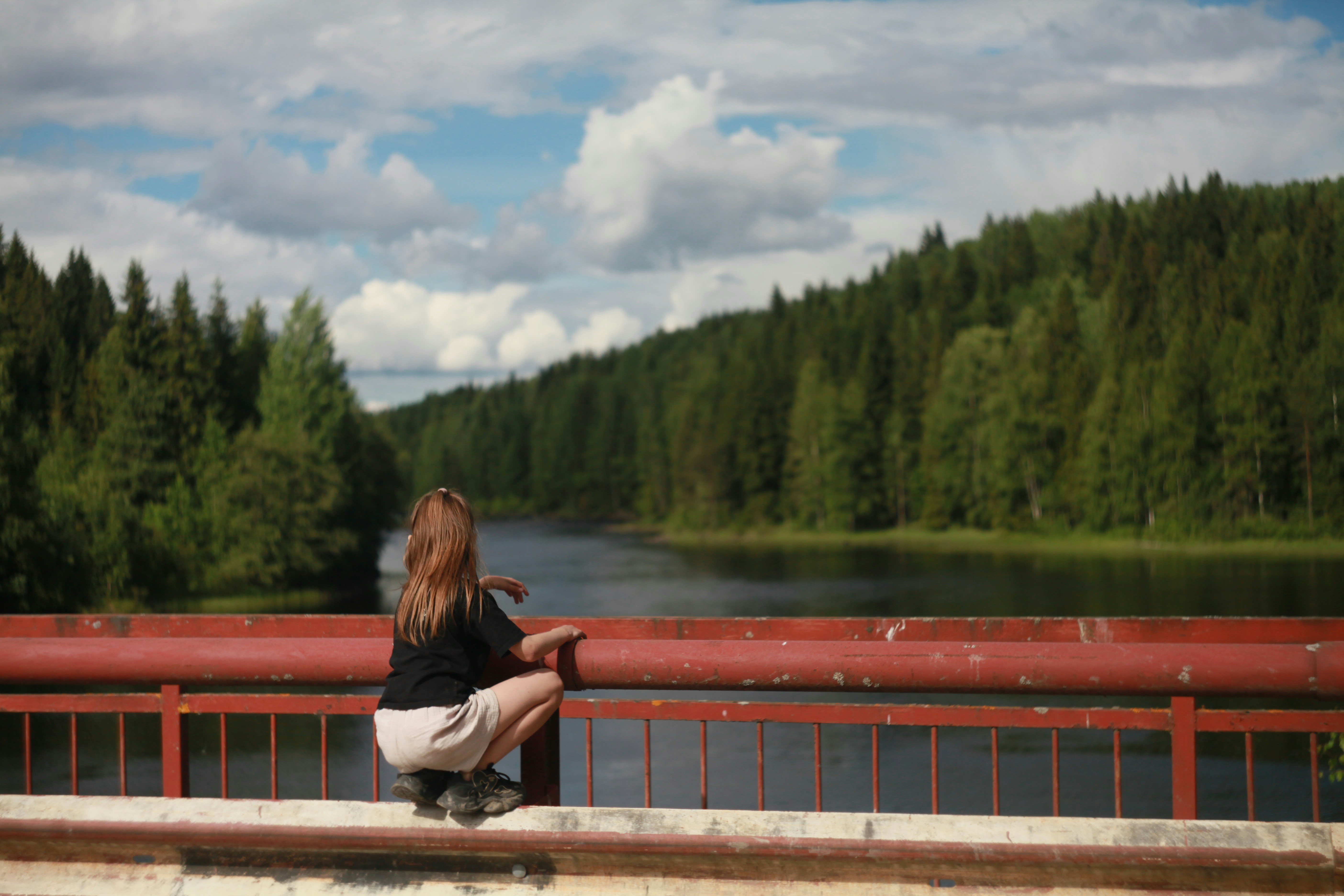 Over the Rails: A Quiet Moment by the Riverbank