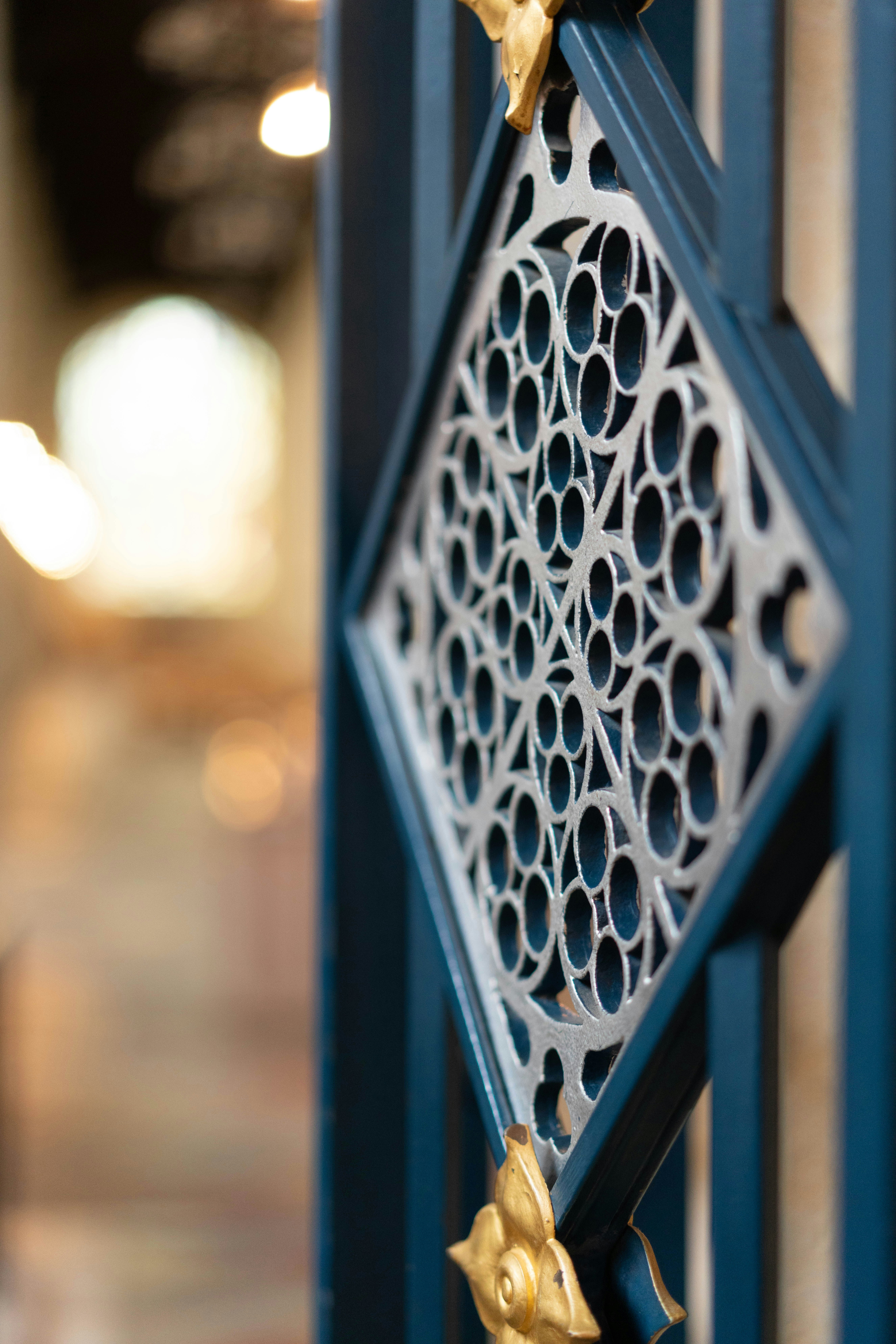 Ornate Blue Lattice Framed by Warm Glow