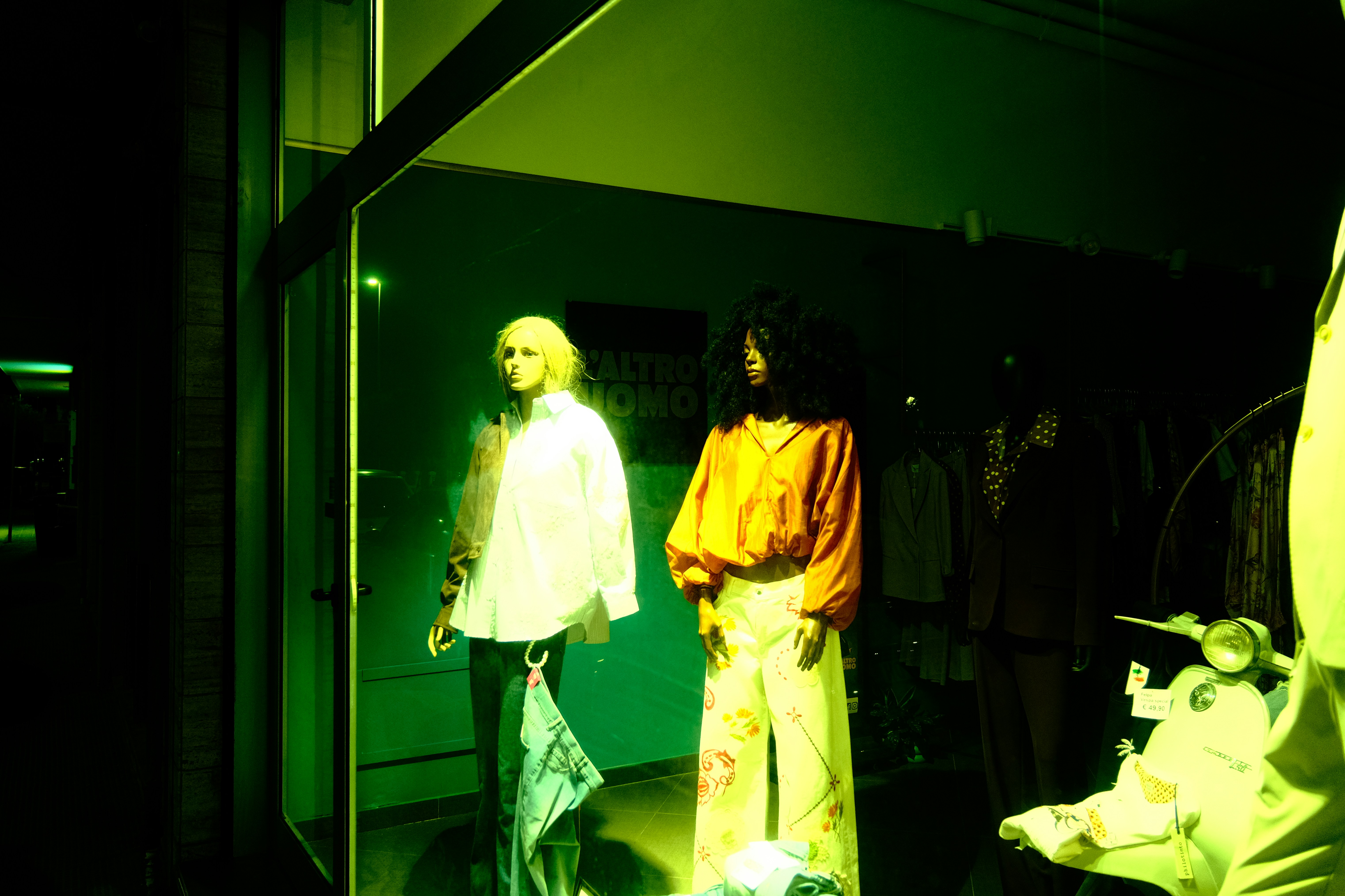 Green Neon Nightfall: Fashion Display in a Boutique Window