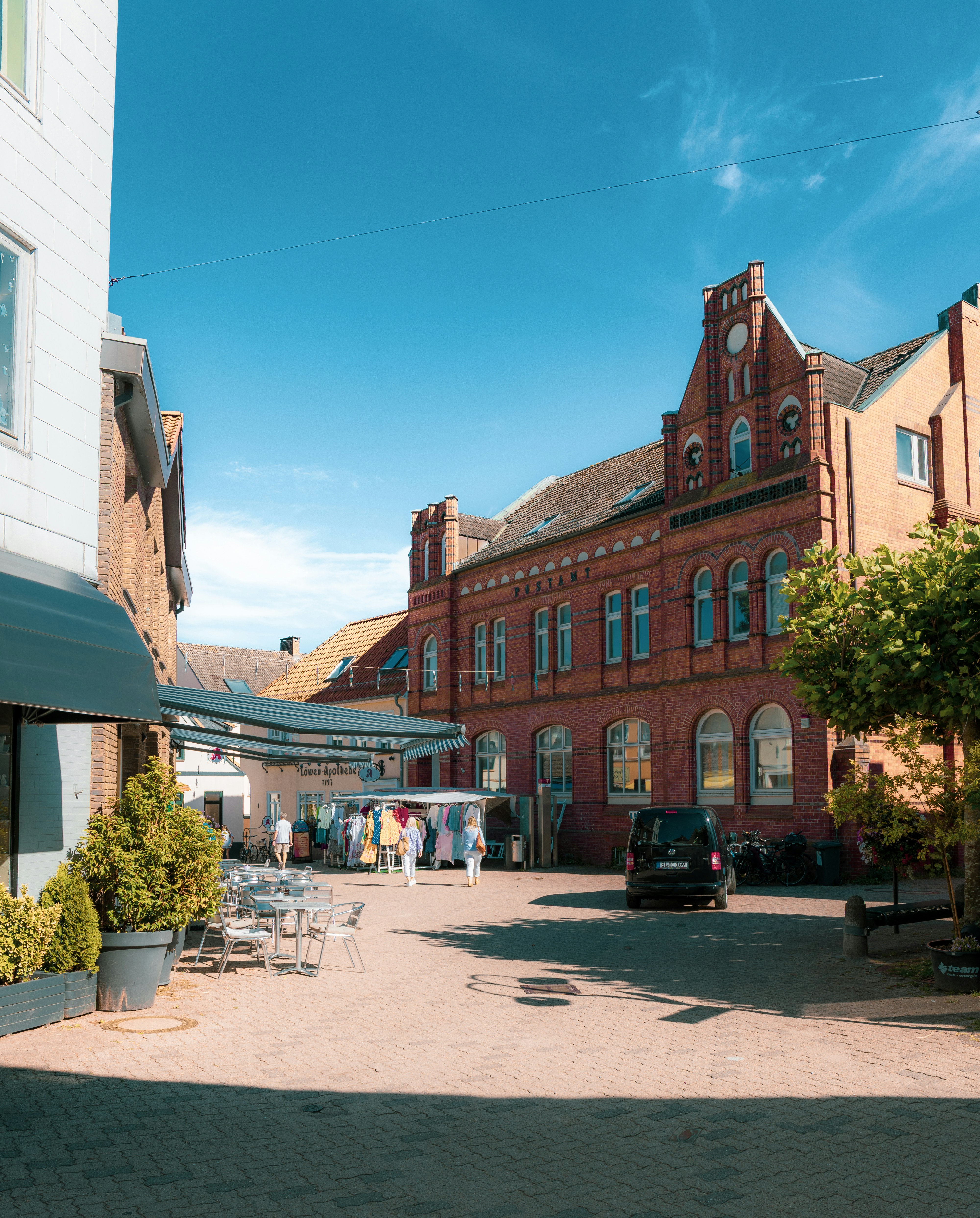 Brick Gothic Courtyard Quietly Bustling with Daylight