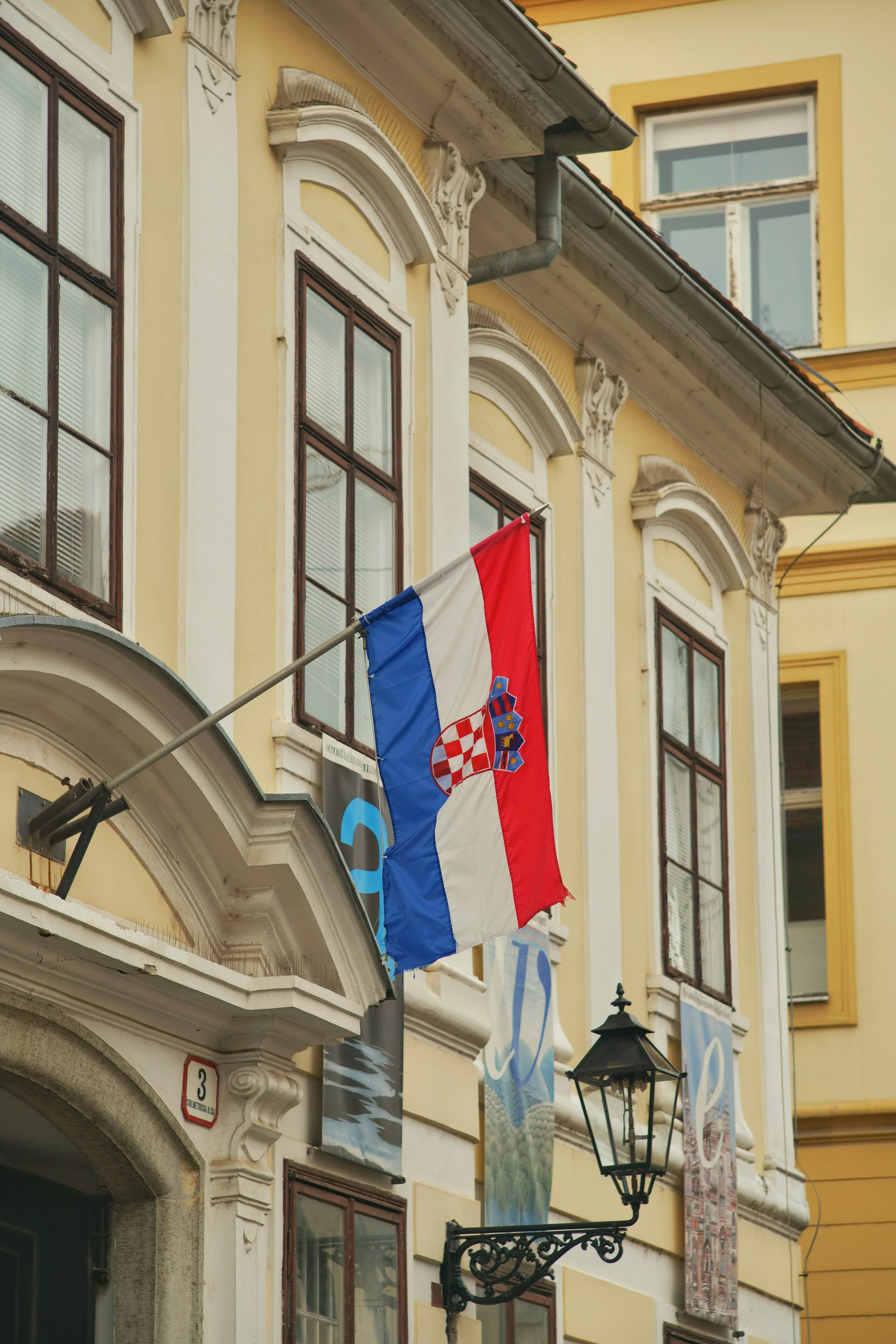 Flag of Croatia Adorns a Sunlit European Facade
