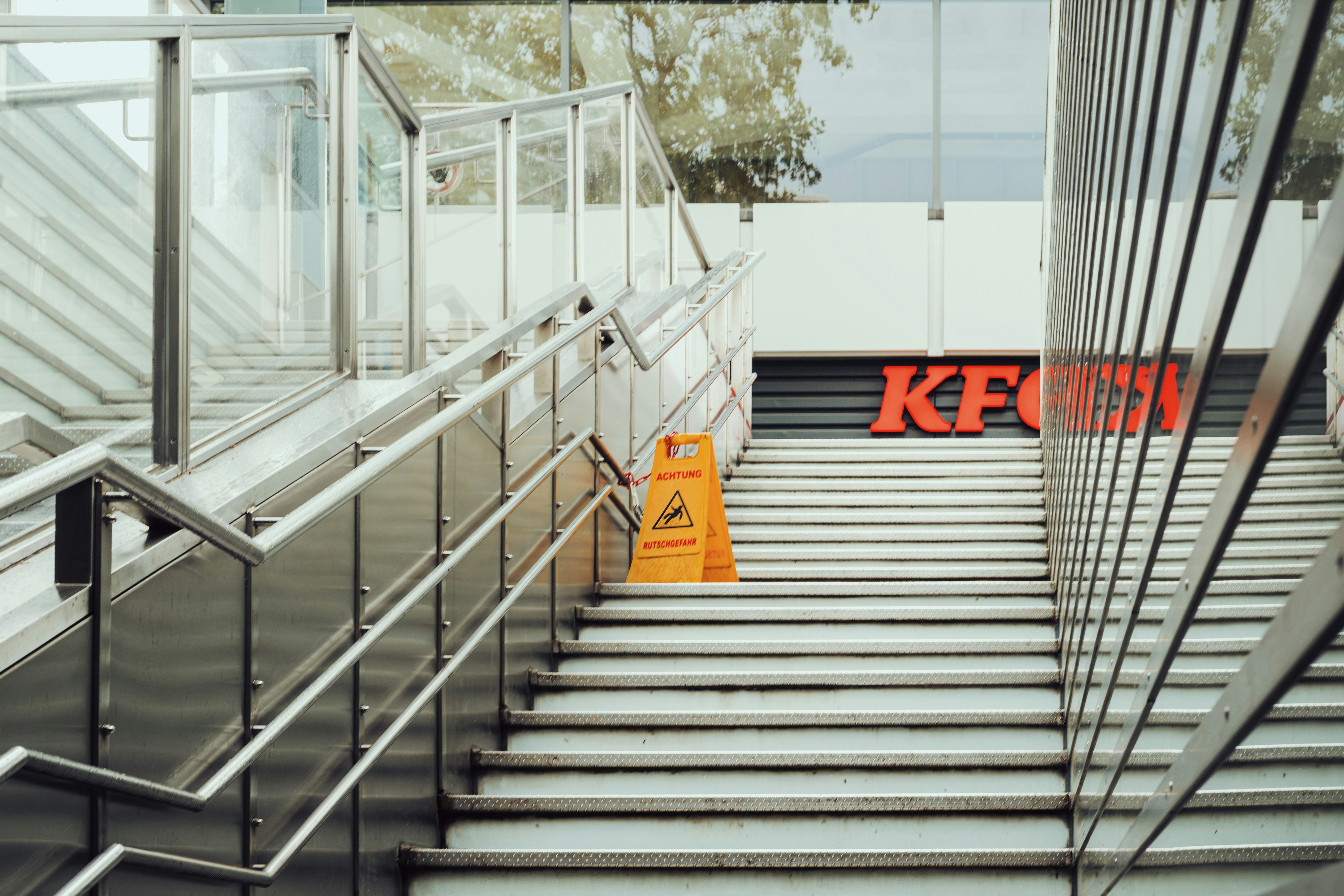 Staircase to a Neon X: A Modern KFC Entrance