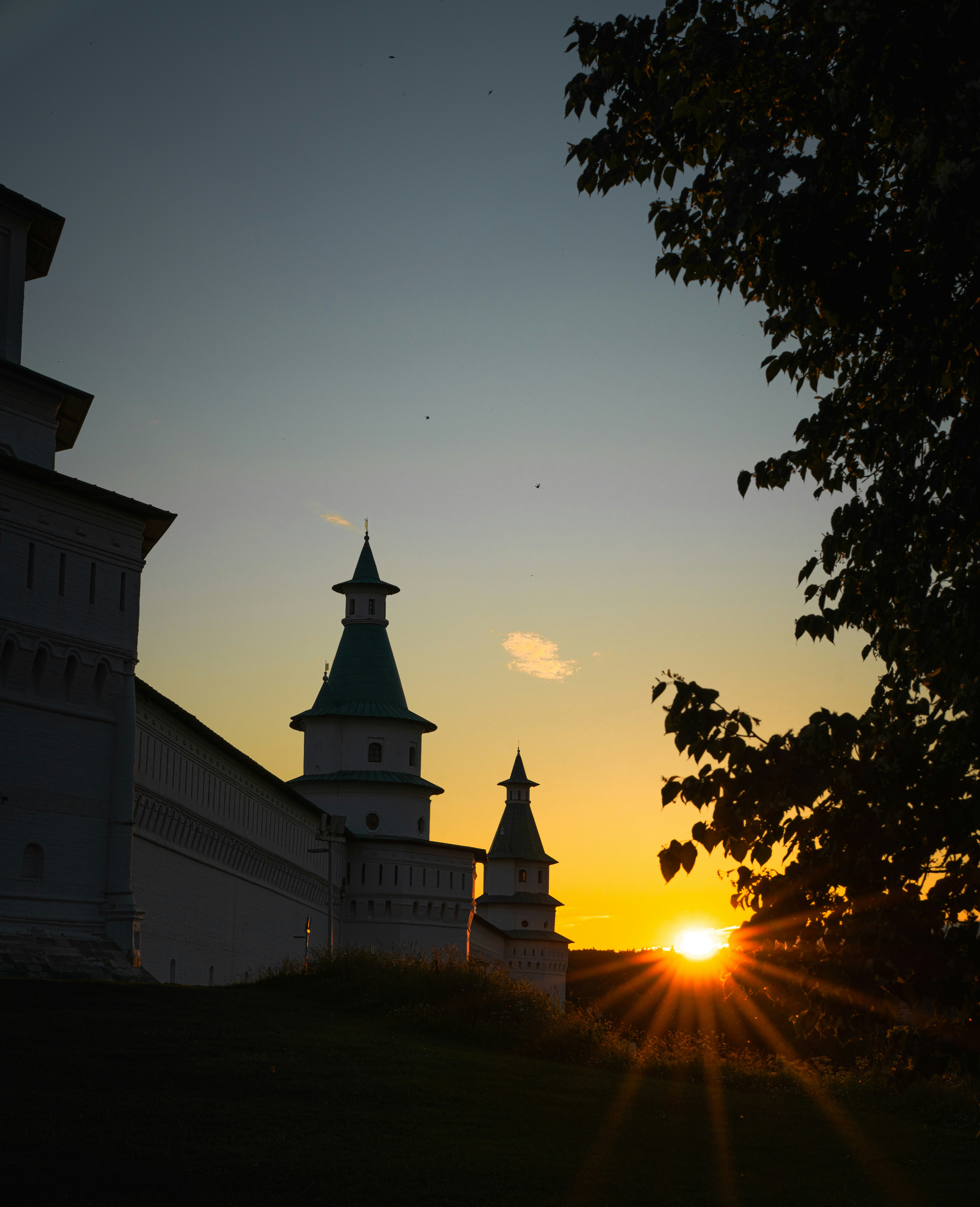 Sunlit Citadel: Towers Framed by a Low Sunset