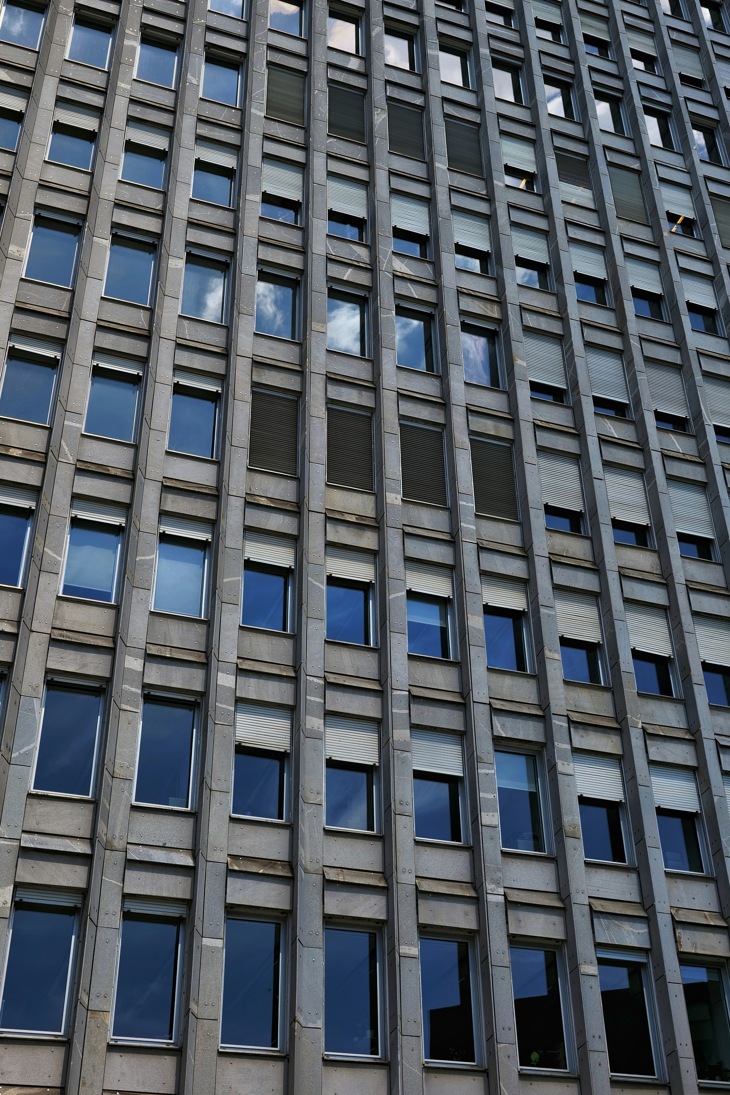 Grid of Glass: A Facade of Repetitive Light and Shadow
