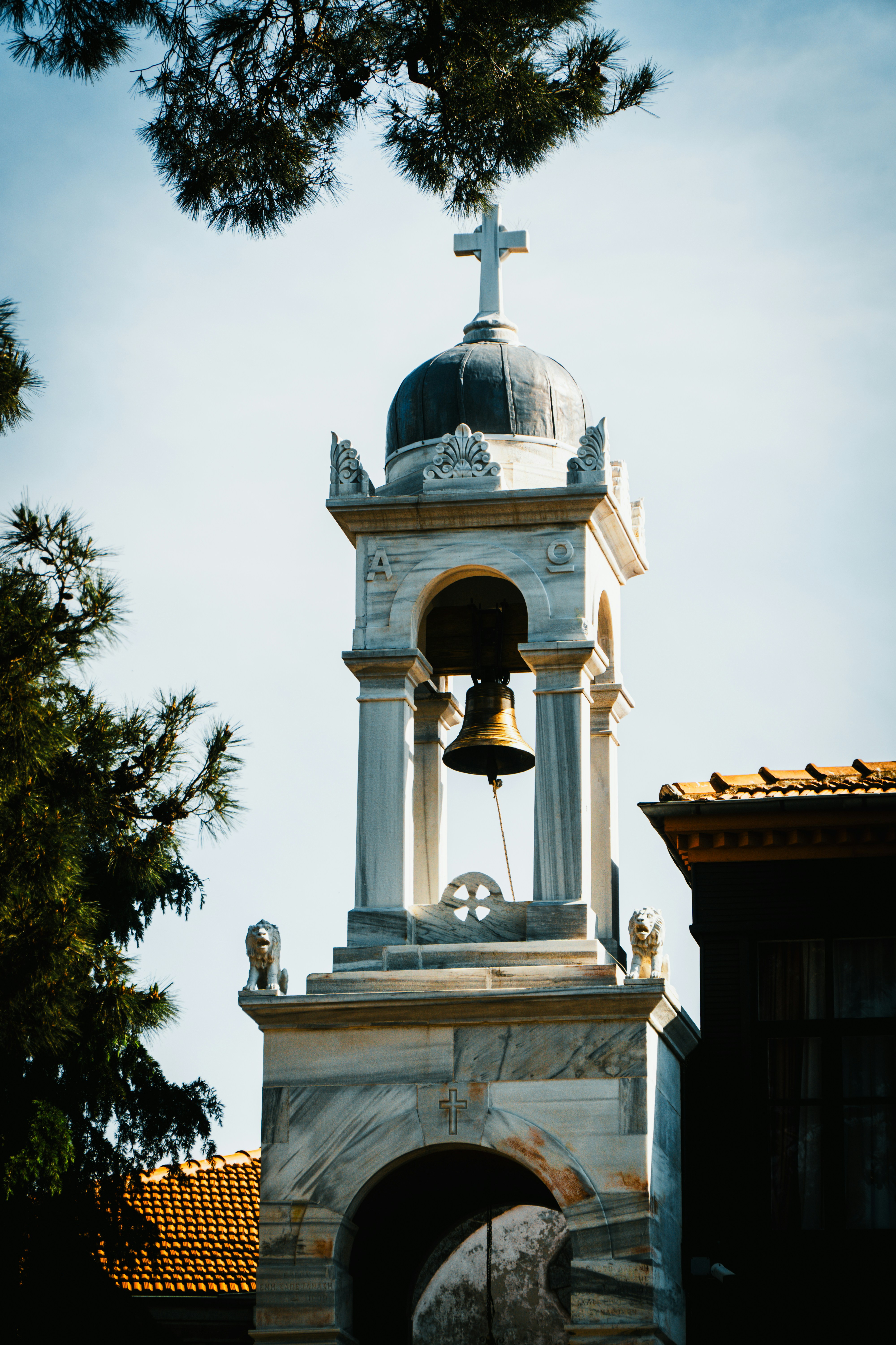 Bell Tower with Cross Beneath a Clear Sky