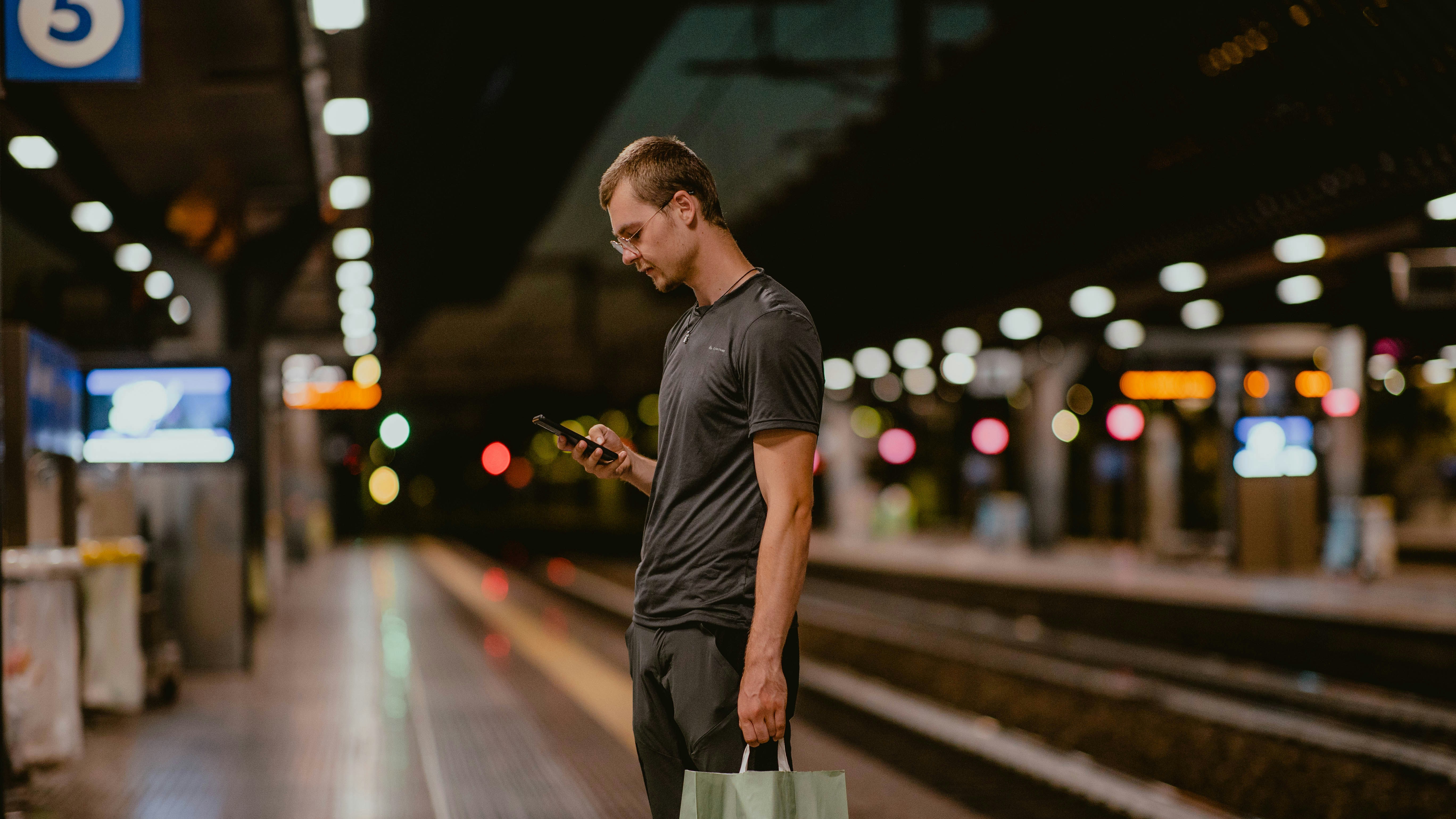 Suspended in a Quiet Moment: A Rider Pauses at the Platform