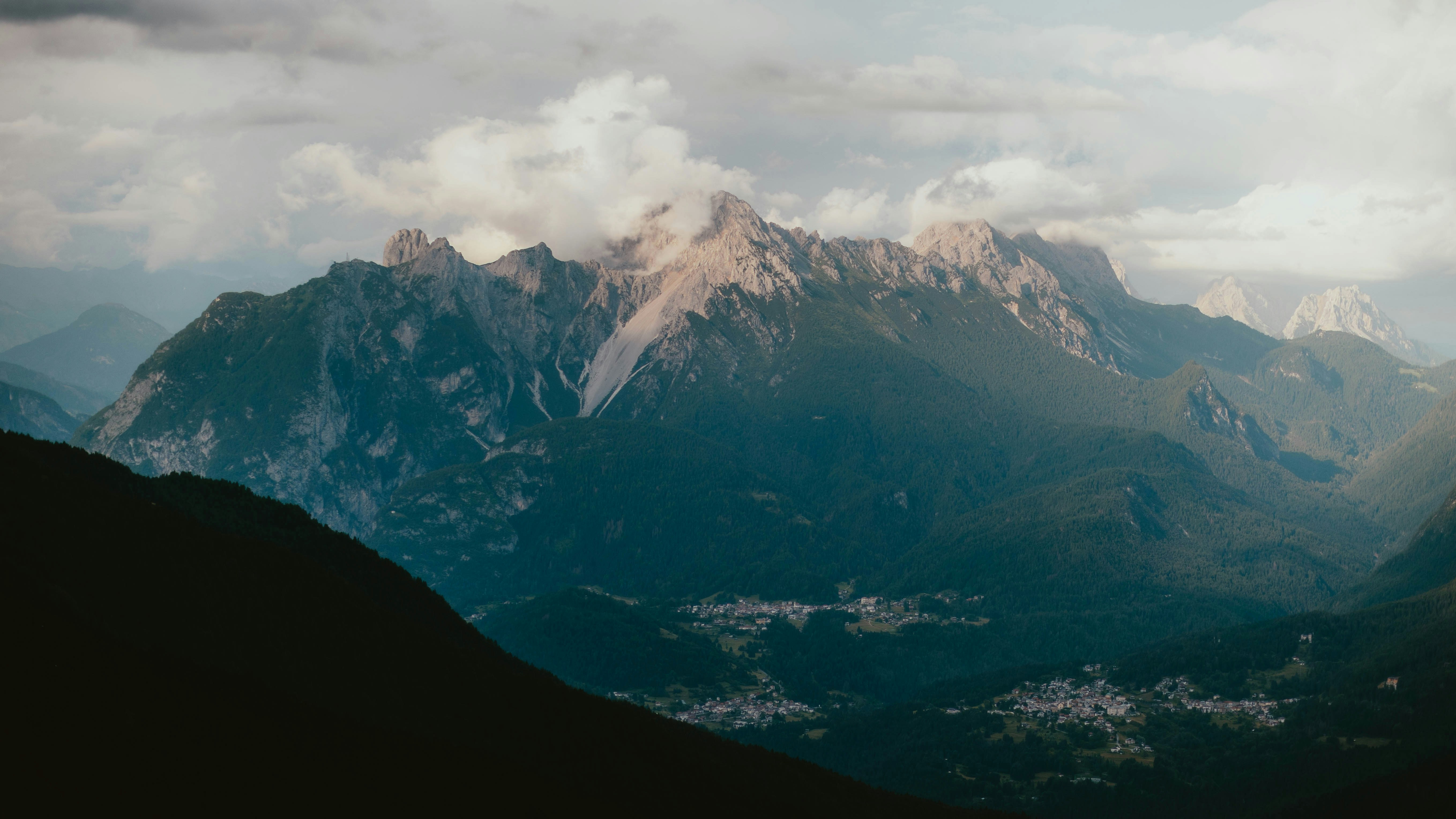 Sunlit Crest: A Majestic Mountain Rim Framed by Shadows