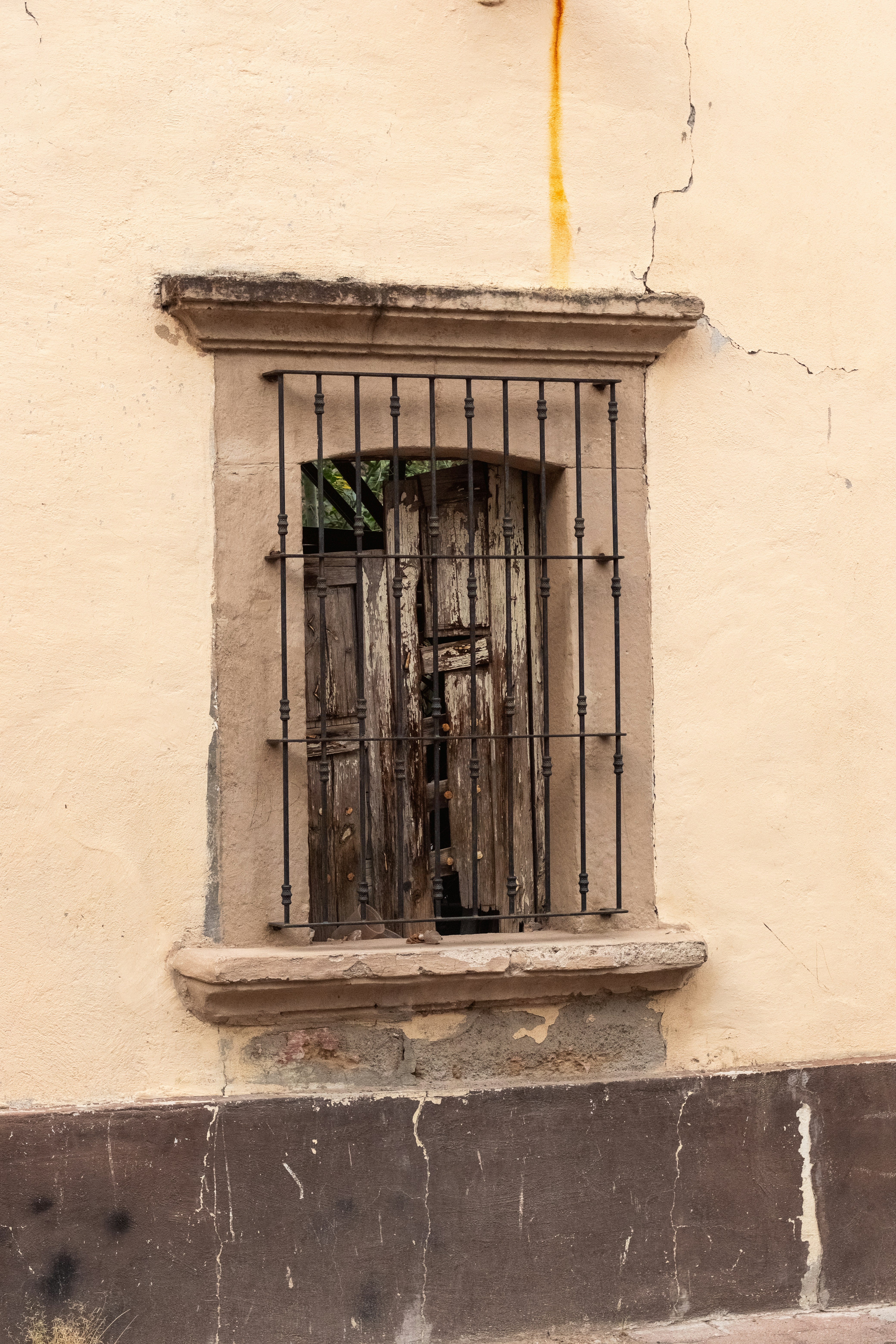 Hidden Doorway Behind Wrought-Iron Veil