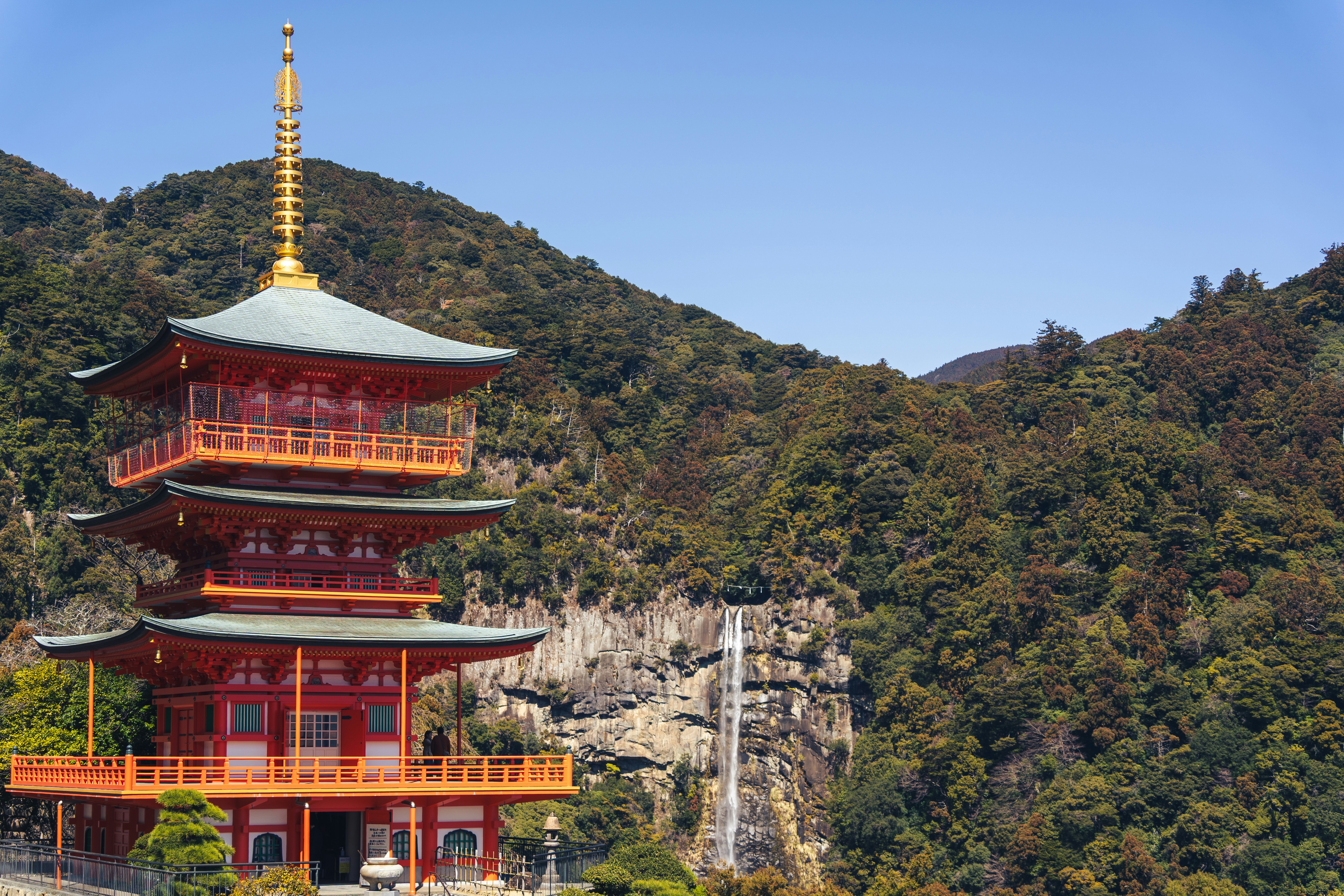 Crimson Pagoda Against a Mountain Tapestry