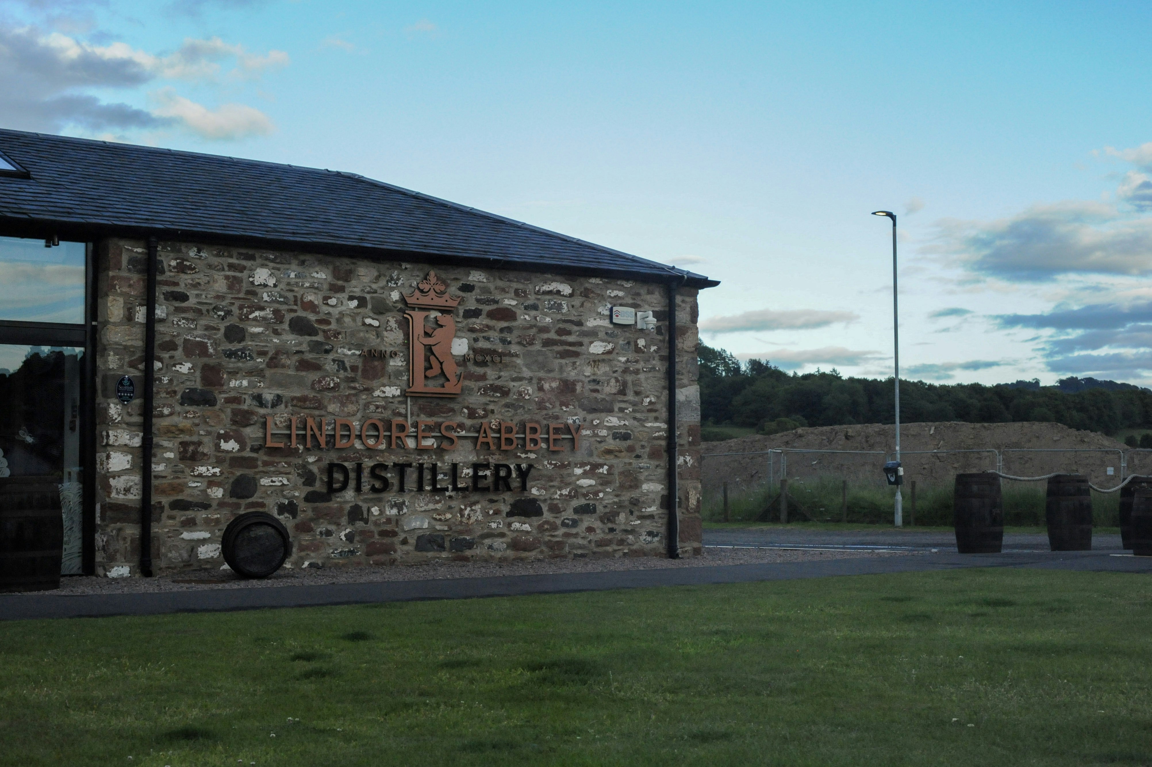 Stone Distillery Wake: Sunlit Facade of Lindores Distillery