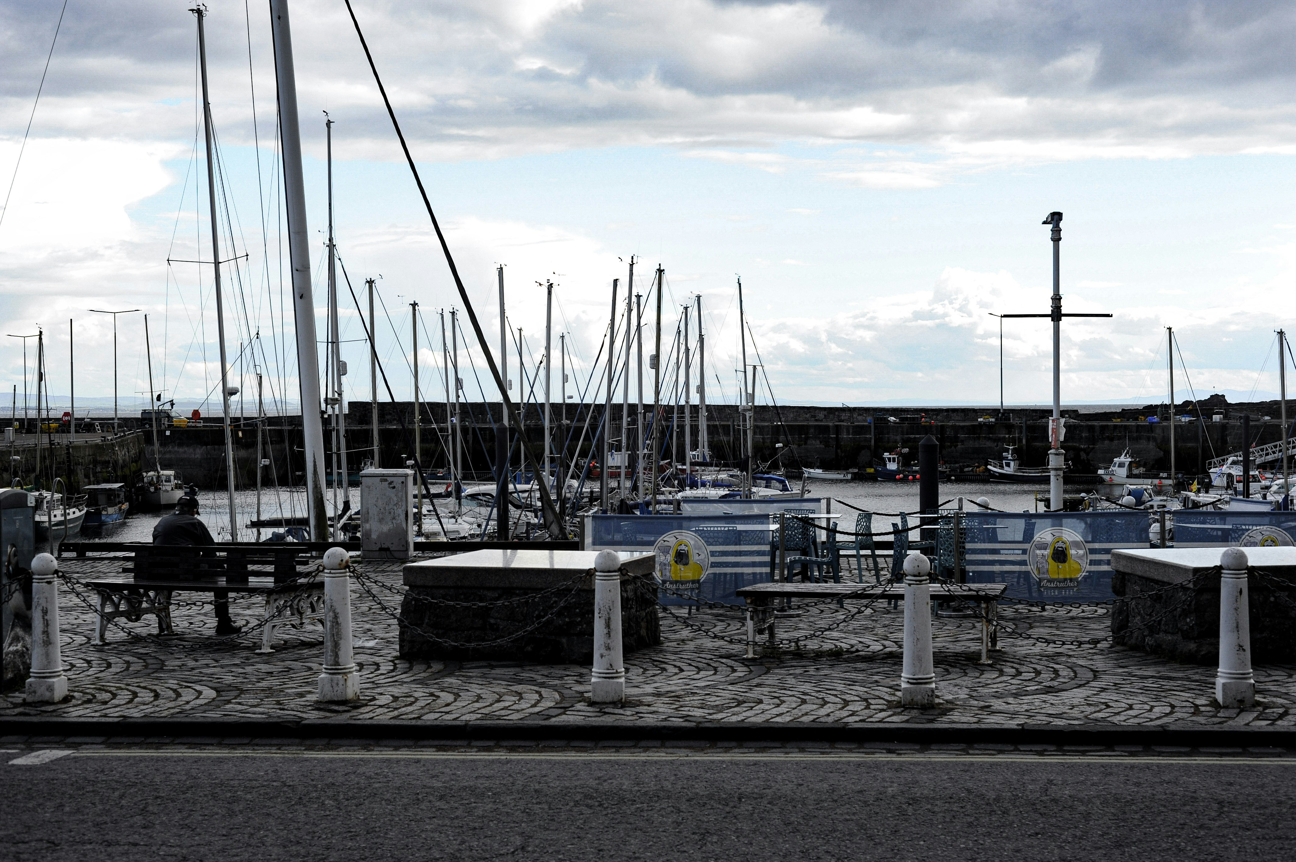 Marina Quiet: Boats Lined Along the Pier at Dusk