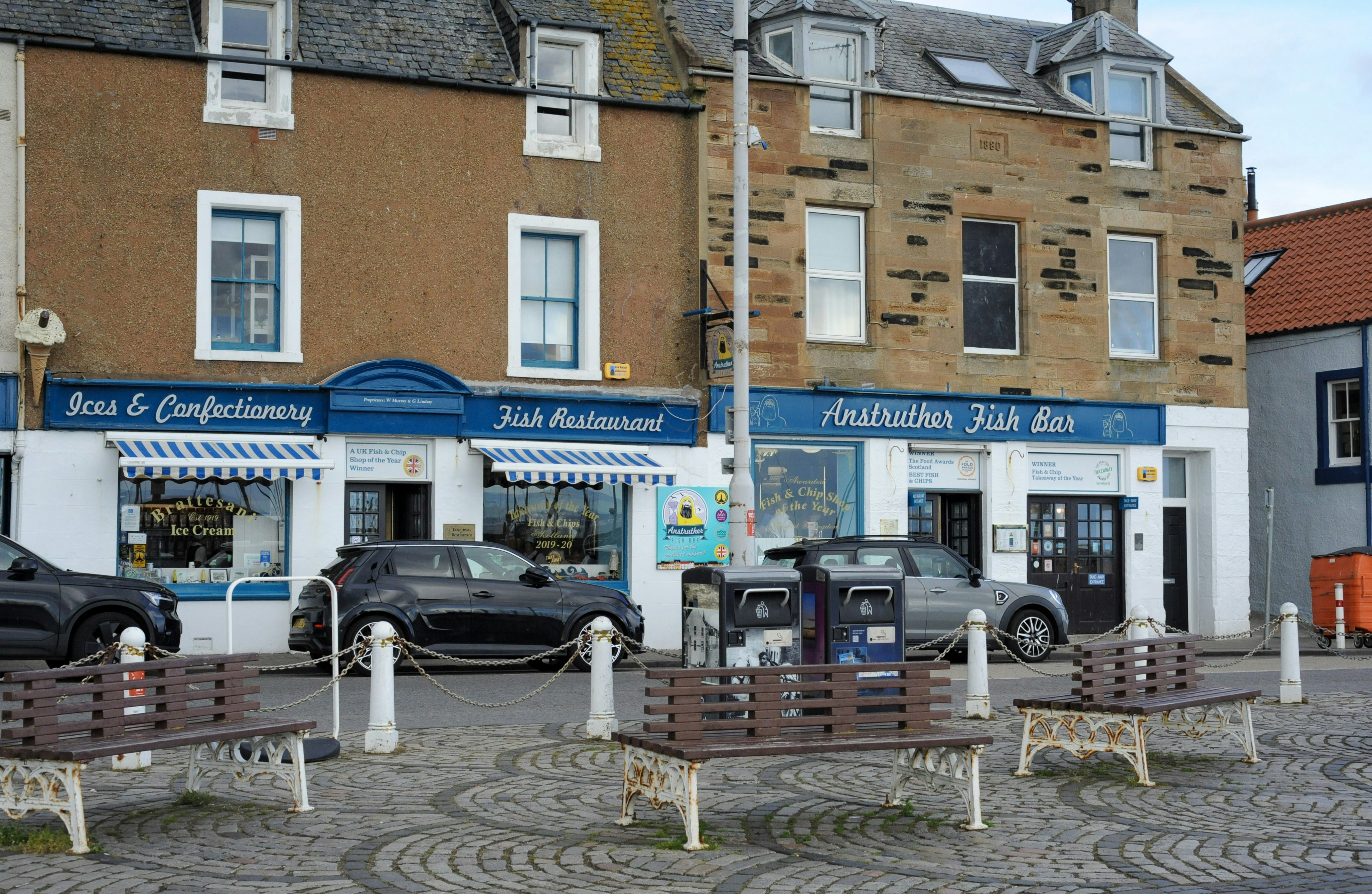 Blue Facades and Sea-side Café Aglow