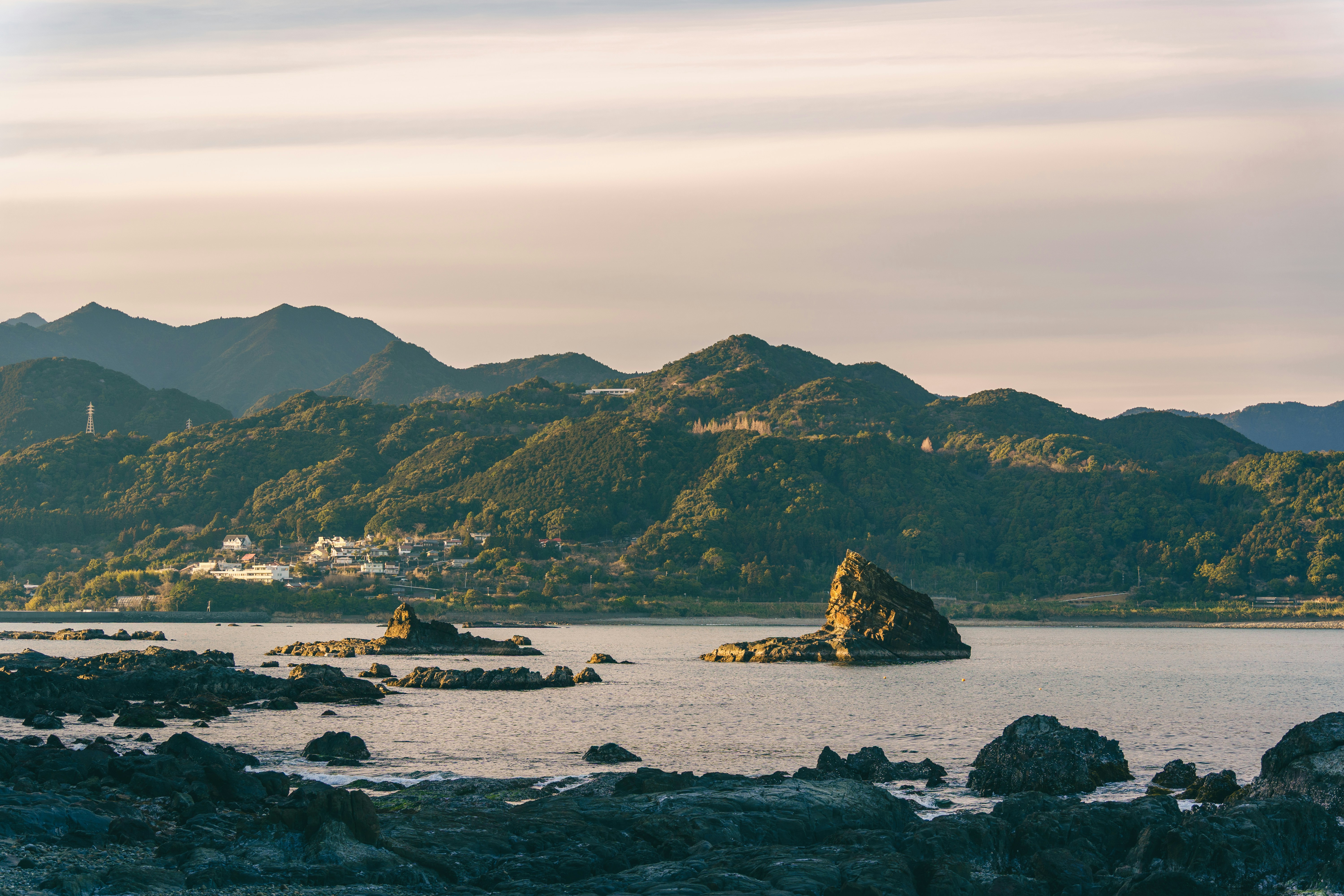 Coastal Ridge at Dusk: Sea Stacks and Quiet Hills
