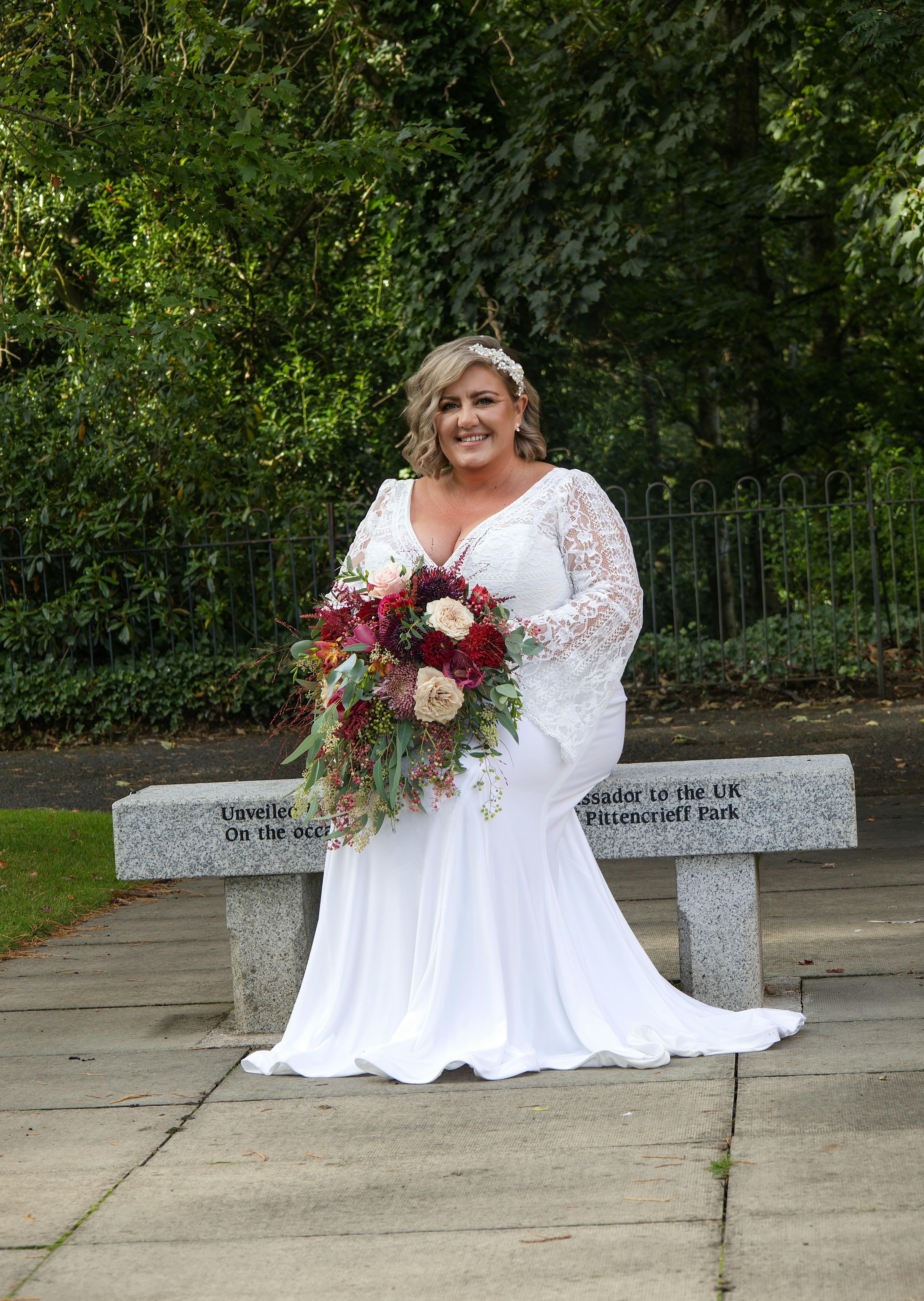 Bride in White with Bountiful Bouquet in a Garden Setting