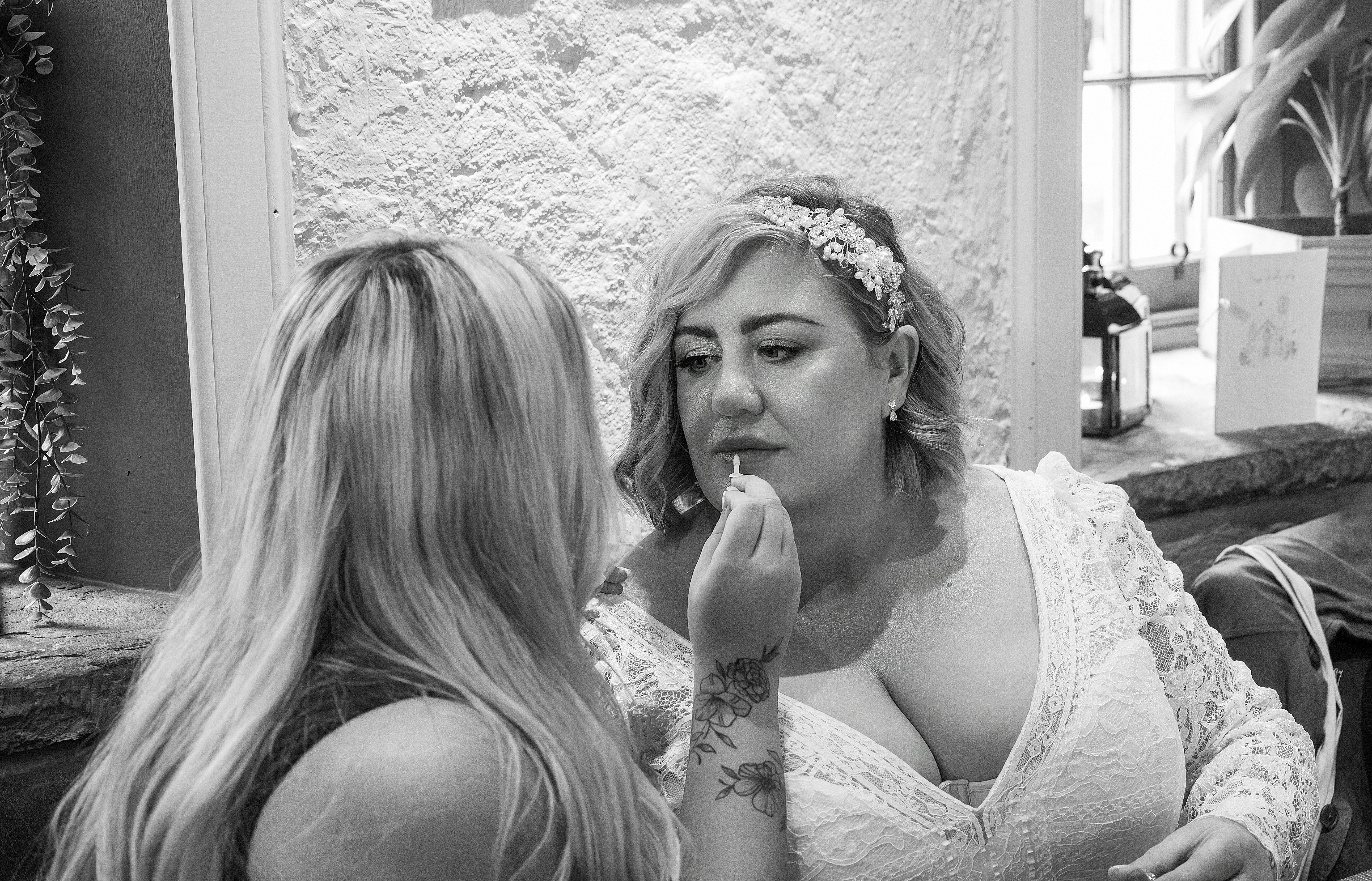 Bride-to-be’s Quiet Moment: Lip Touch-Up Before the Photo
