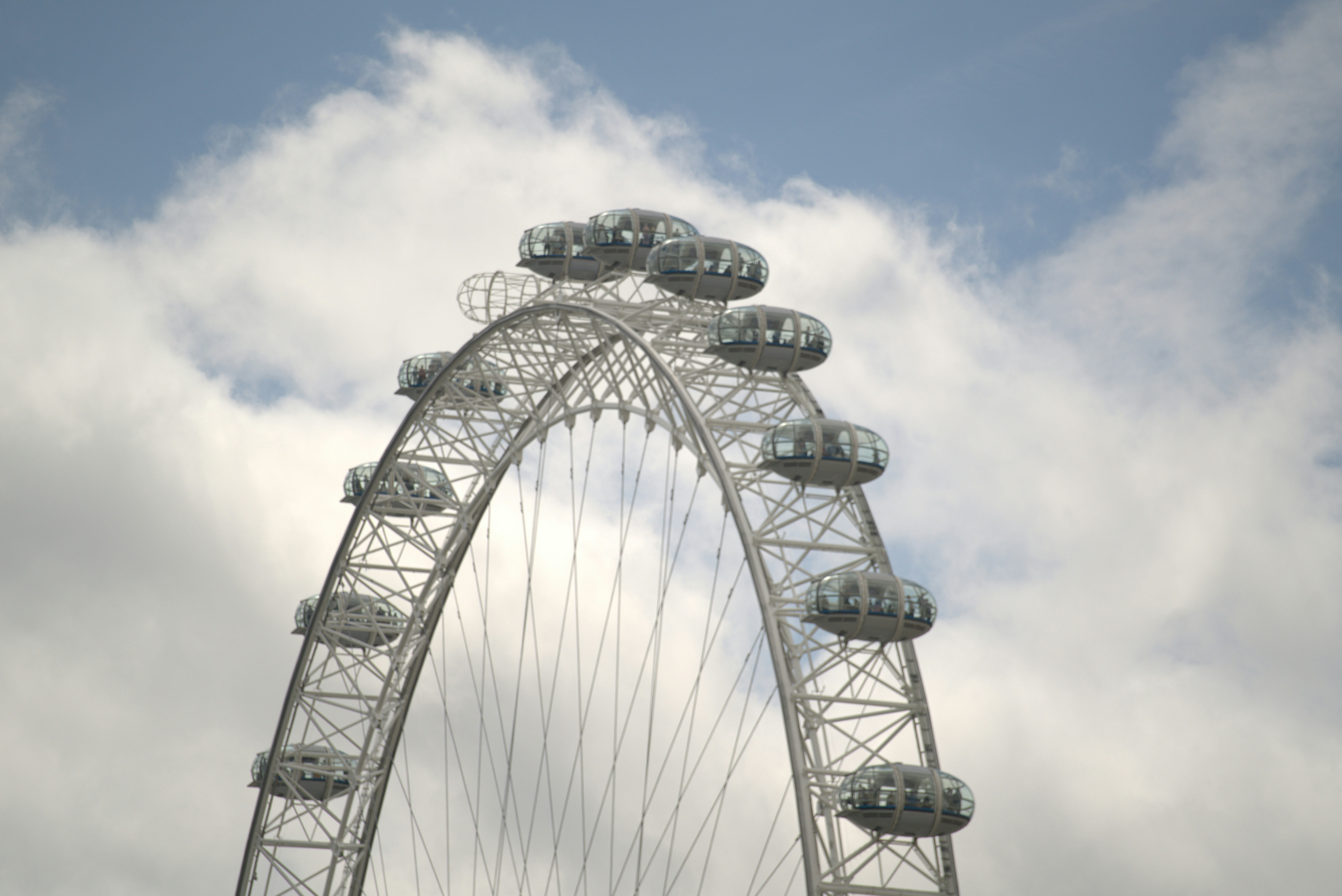 The London Eye Piercing Through a Cairn of Clouds