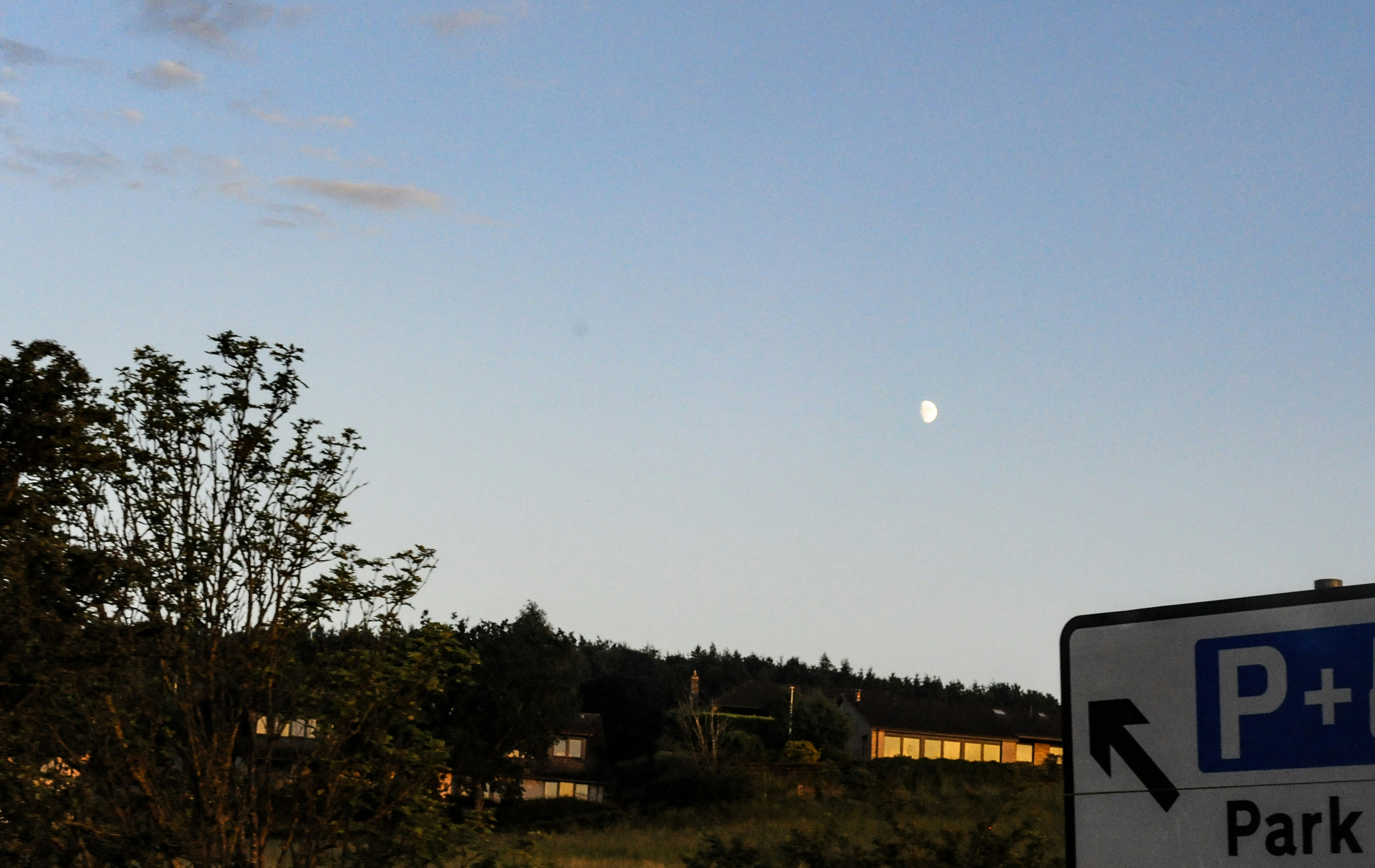 Dusk Moon Over Parking Silver: A Quiet Suburban Field