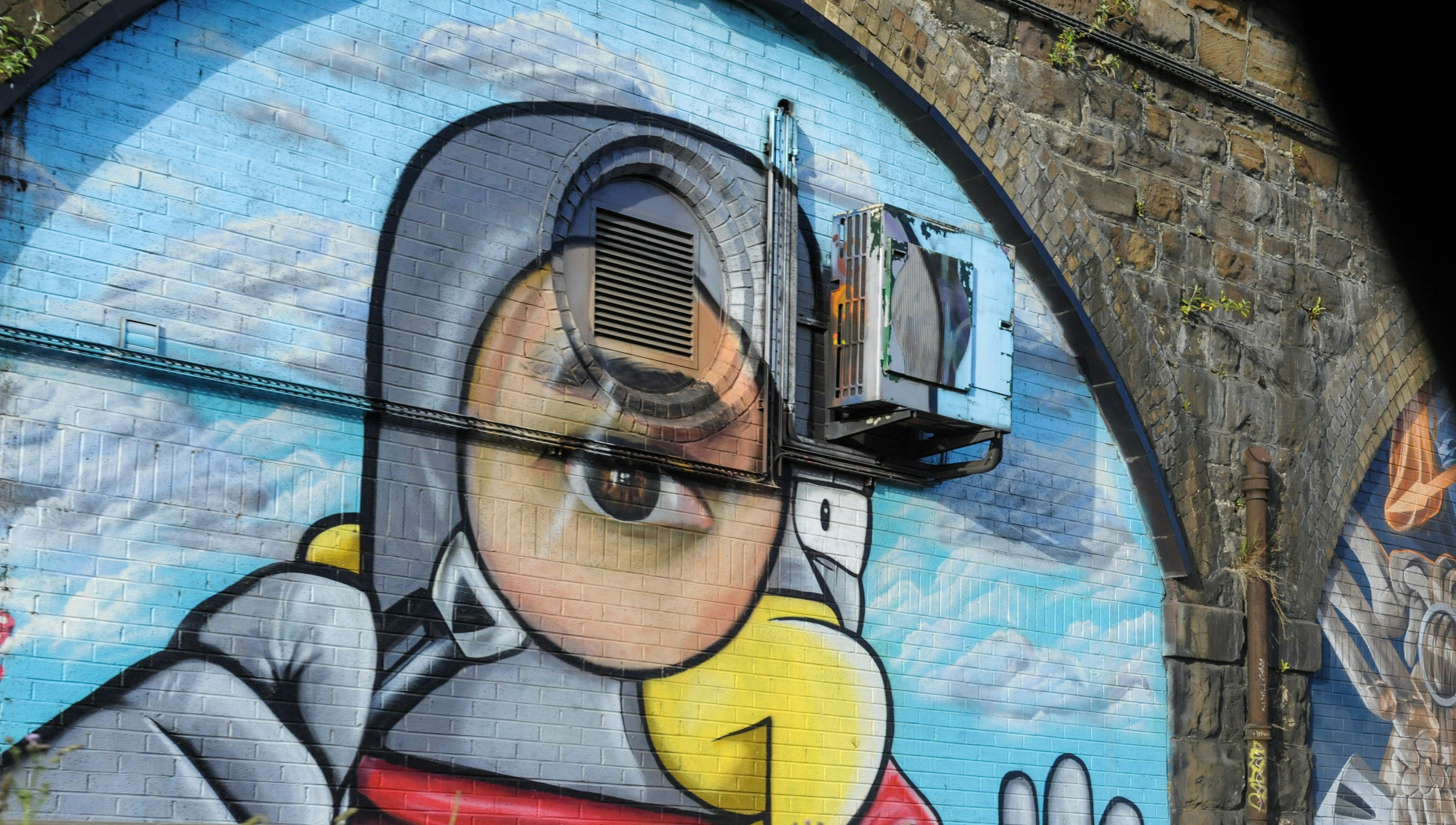 Peering Through Graffiti: A Cartoon Parrot Watches from the Wall
