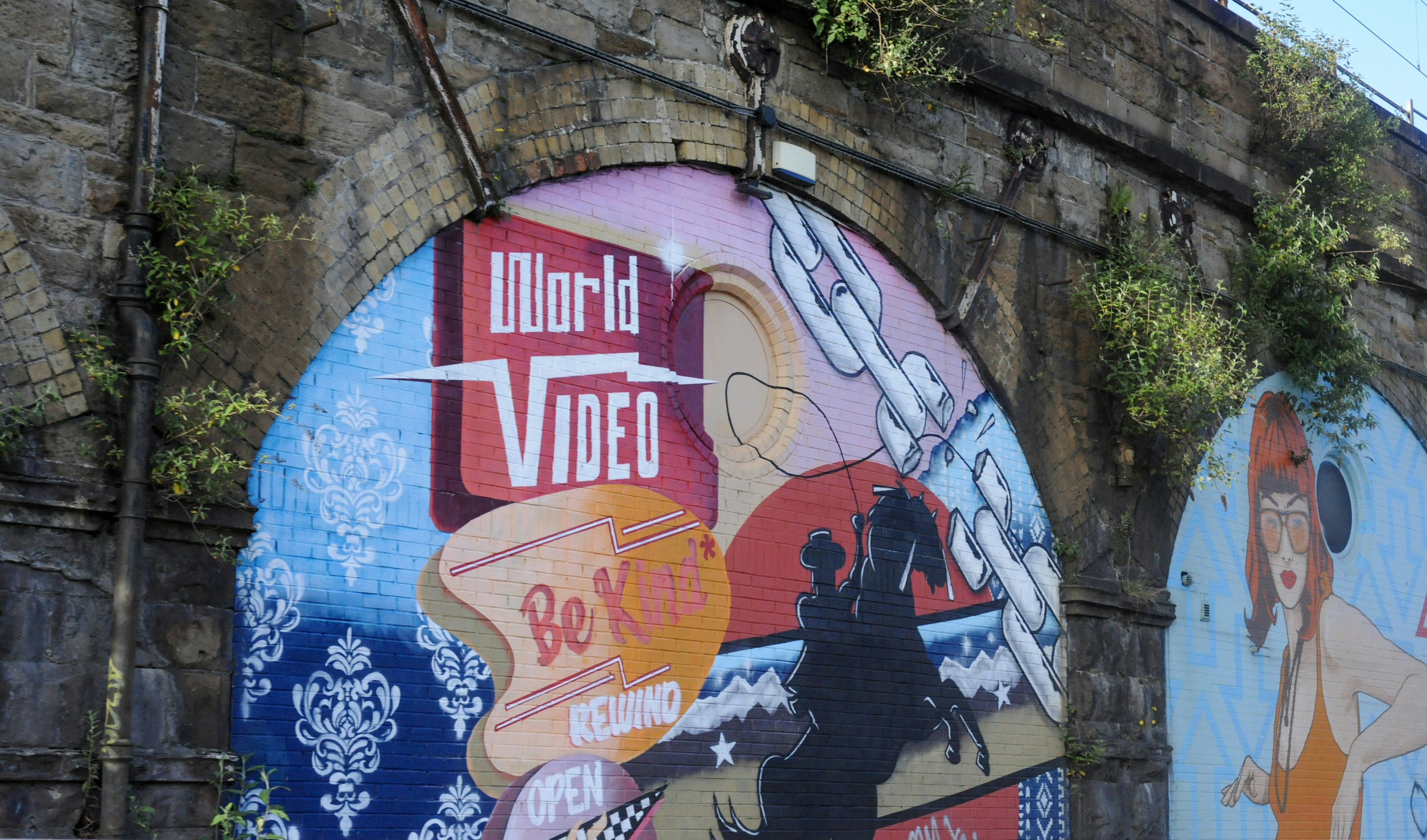 City Wall Canvas: World Video Graffiti and Silhouette