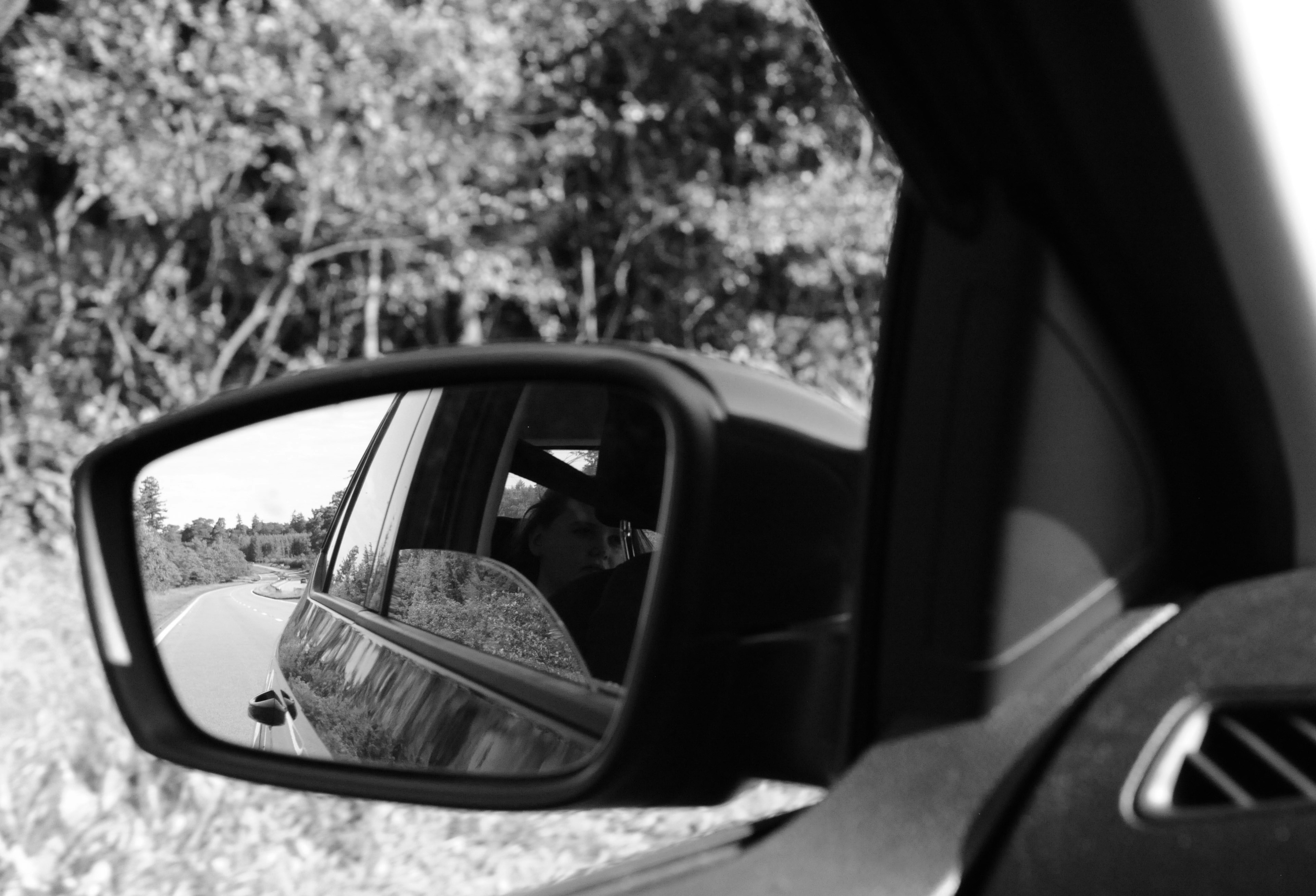 Side-View Mirror Snapshot: Framed Road Reflections