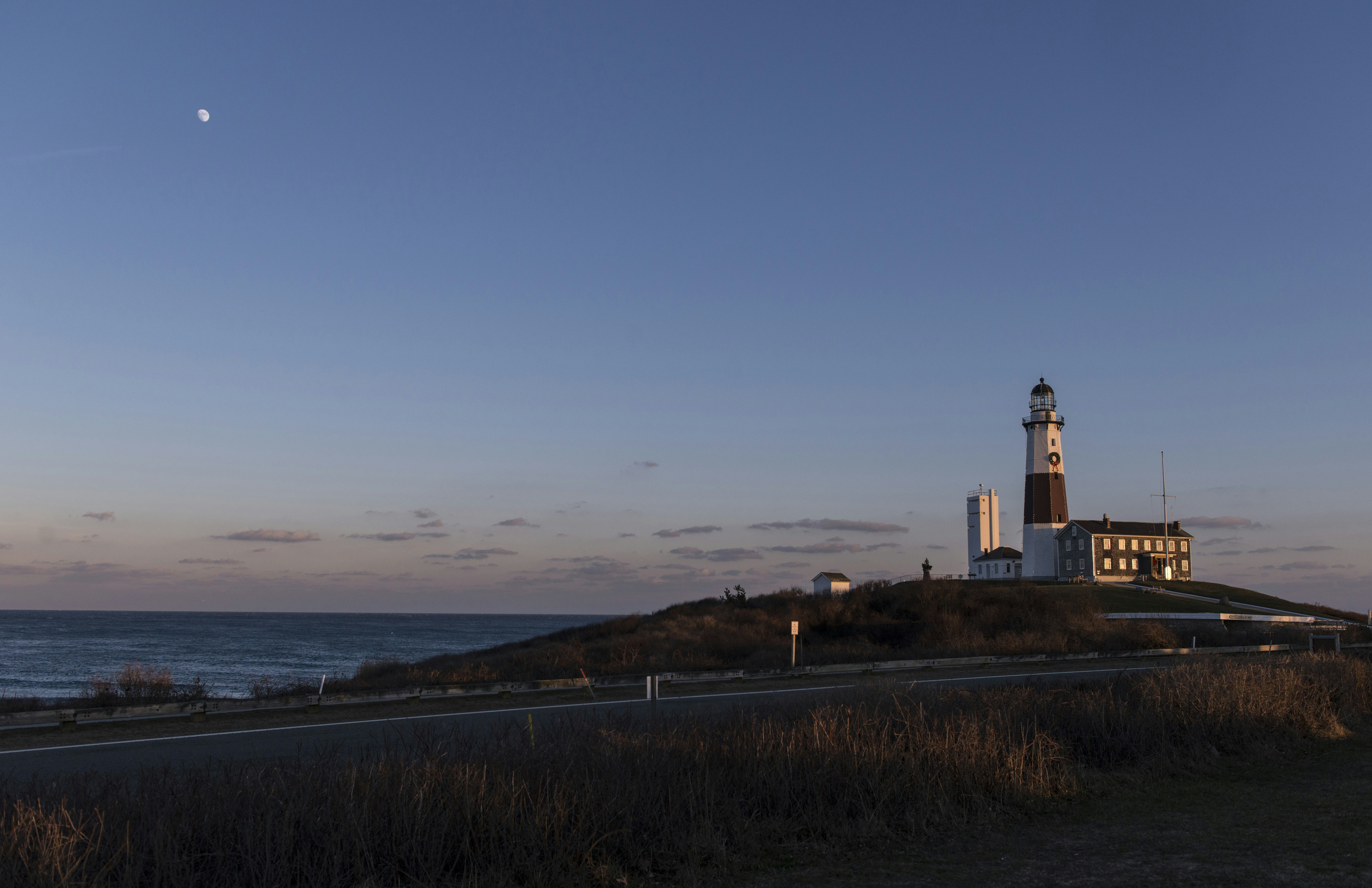 Dawn’s Sentinel: Lighthouse overlooking a quiet coastline