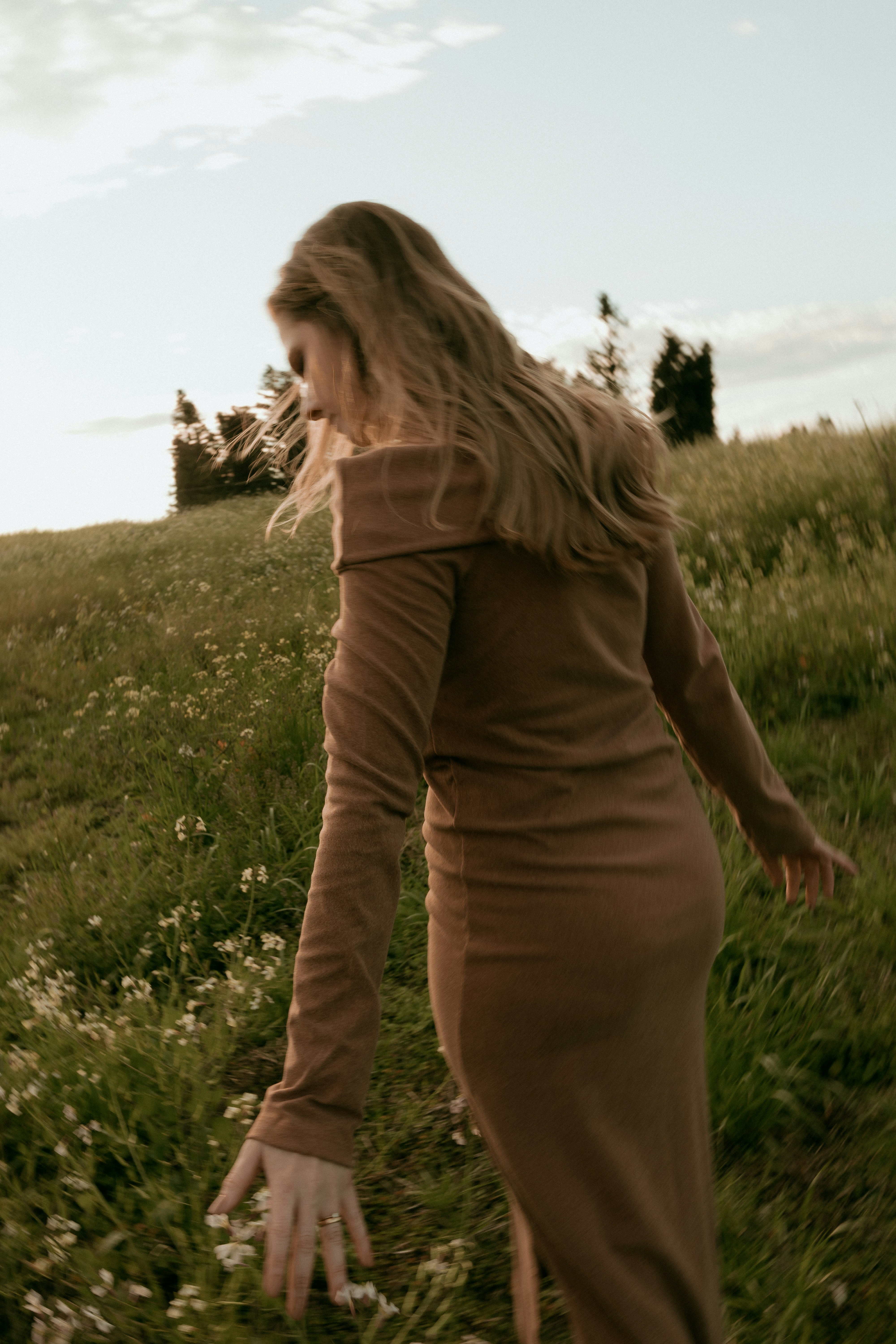 Golden Hour Silhouette: A Woman in a Field