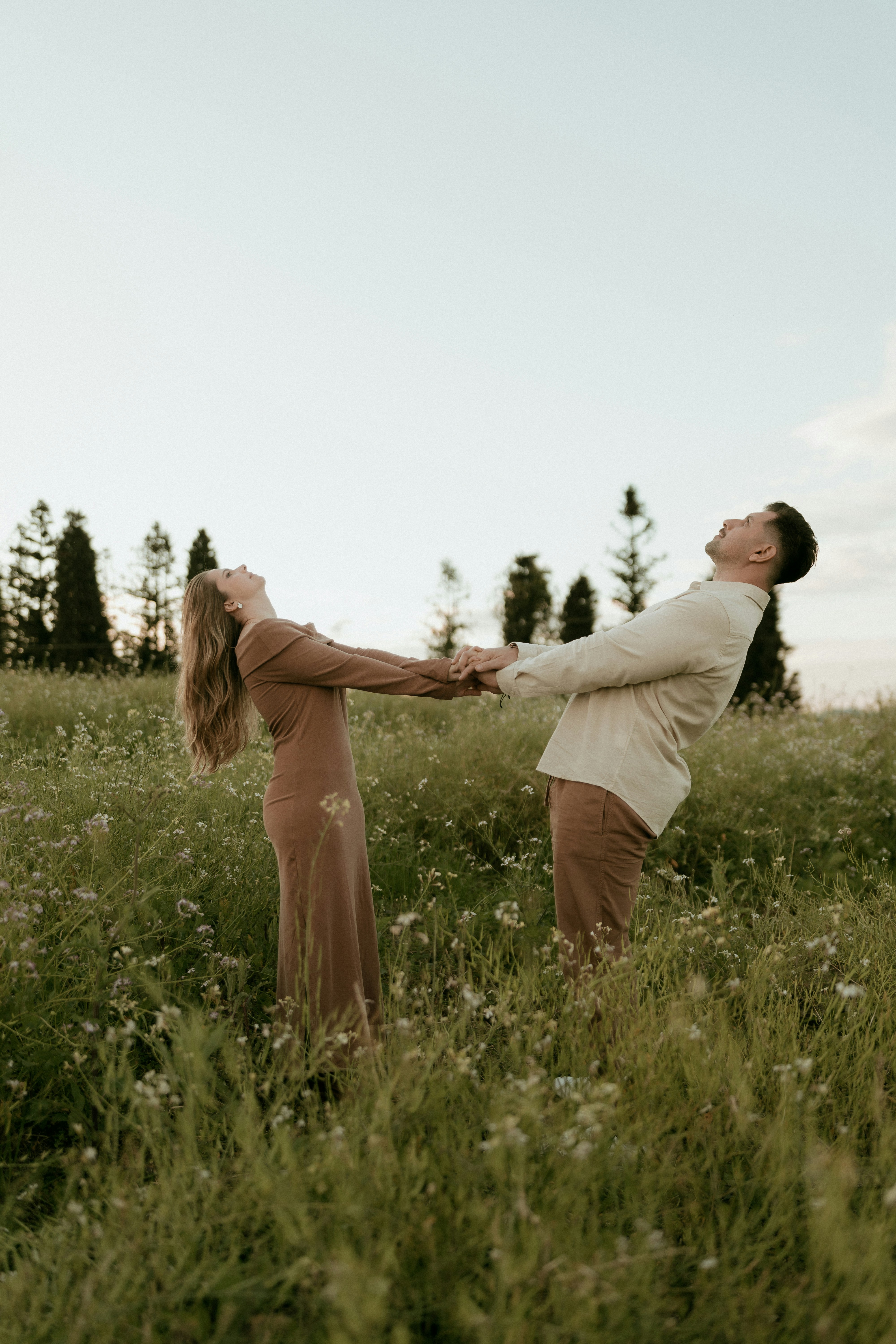 Holding On: A Dandelion Field Embrace