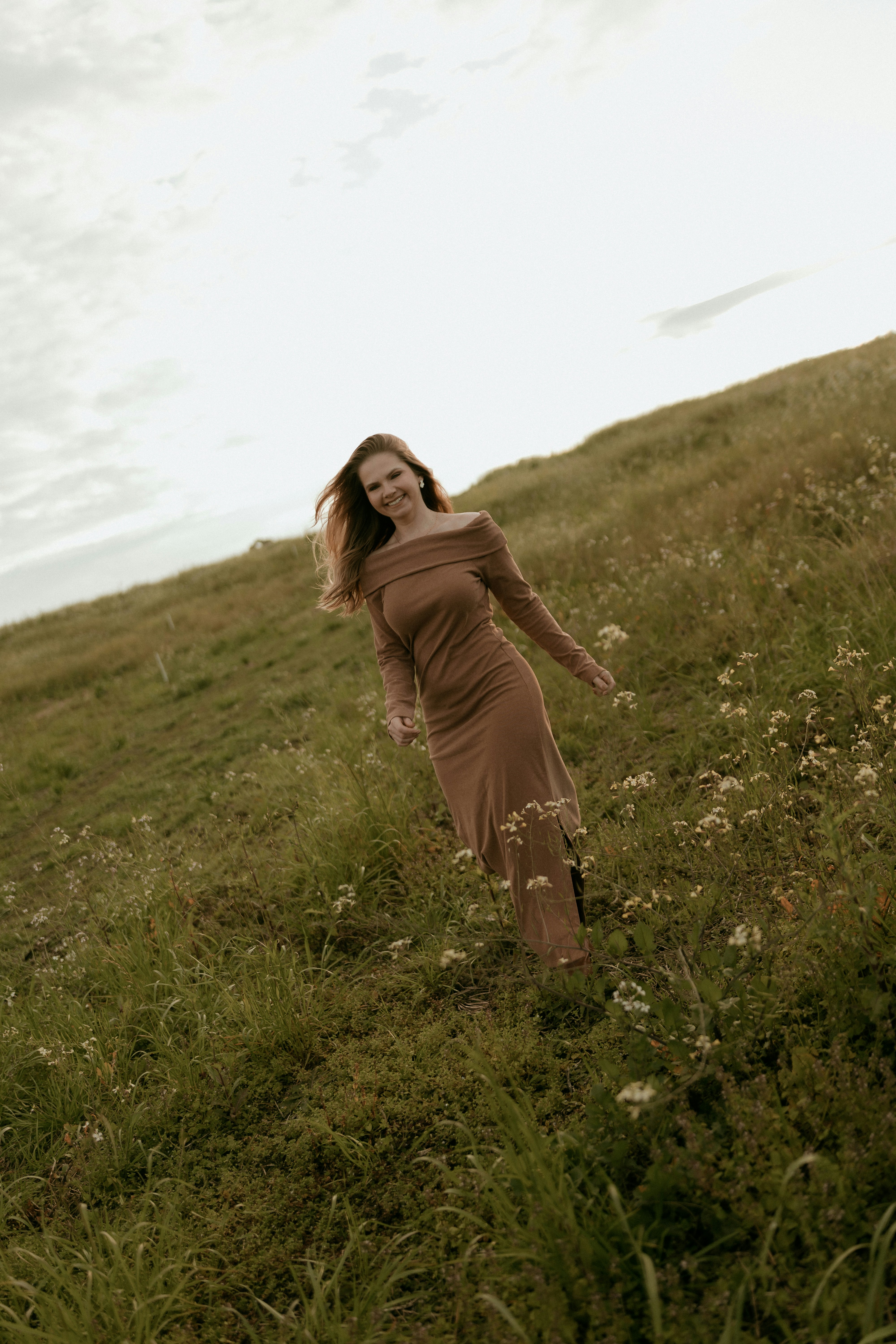 Field of Quiet Warmth: A Woman in a Mauve Dress on a Golden Hill