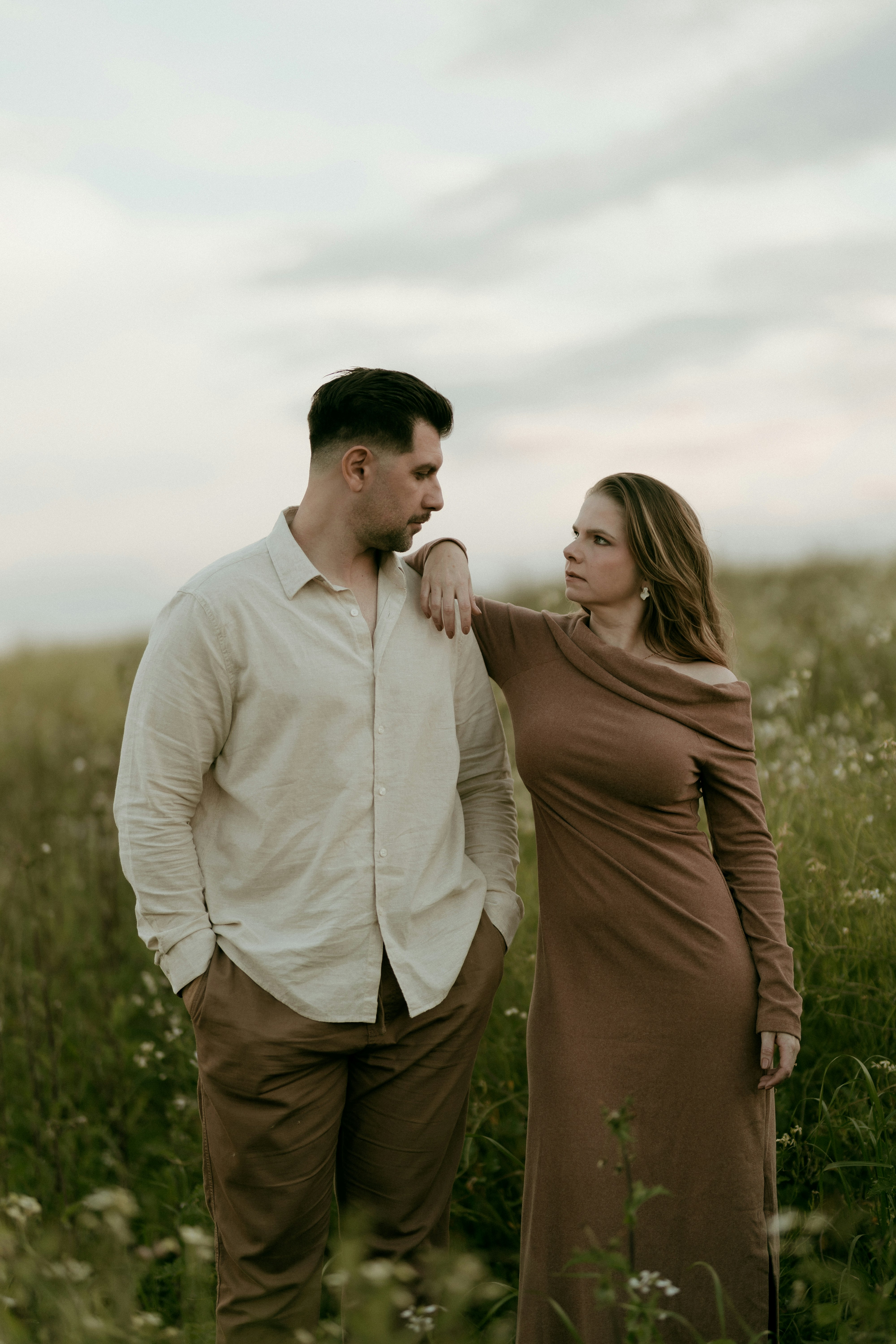 Couple in a Golden Field: Quiet Connection at Dusk