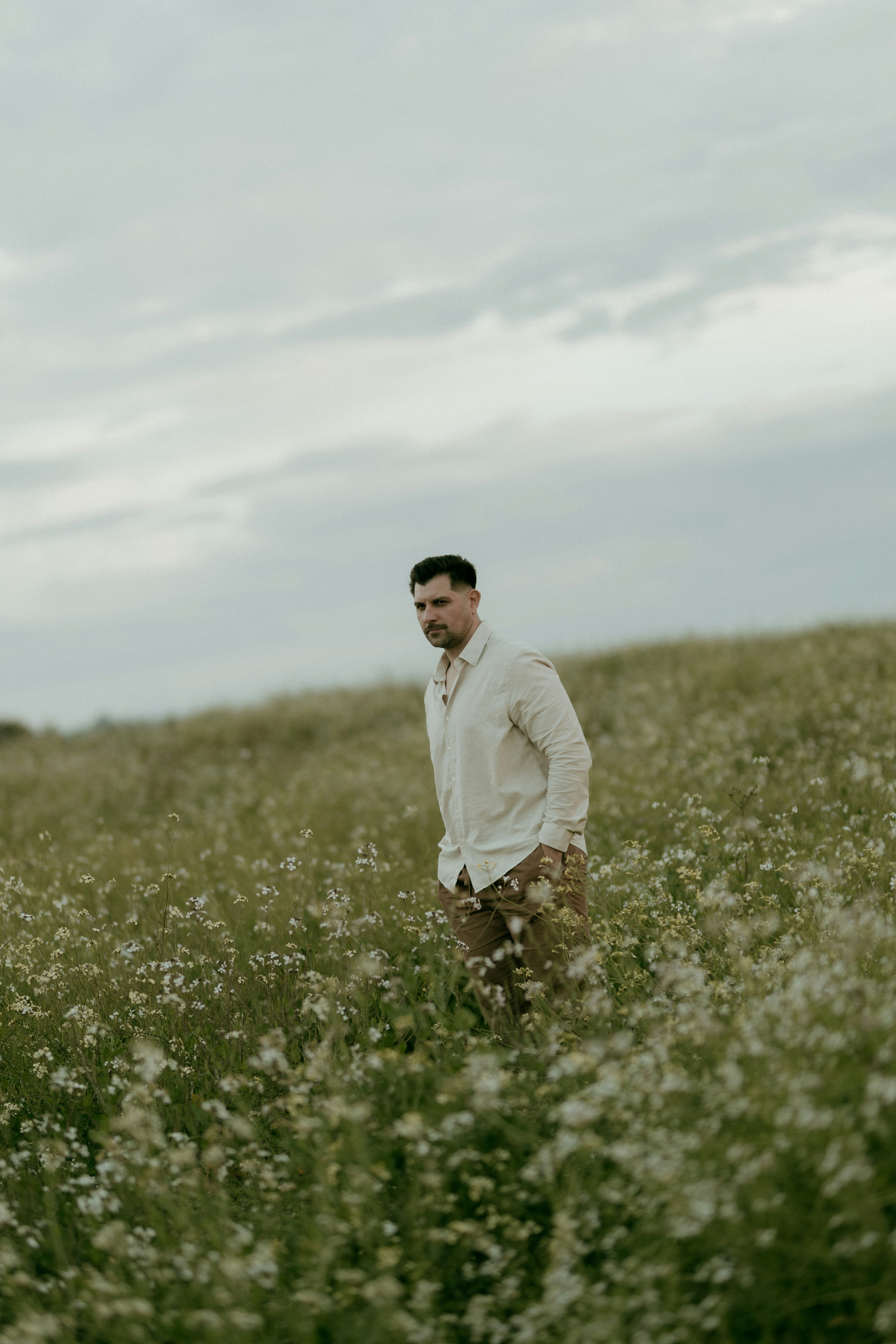 Fieldbound Portrait: Quiet Resolve Under Overcast Skies