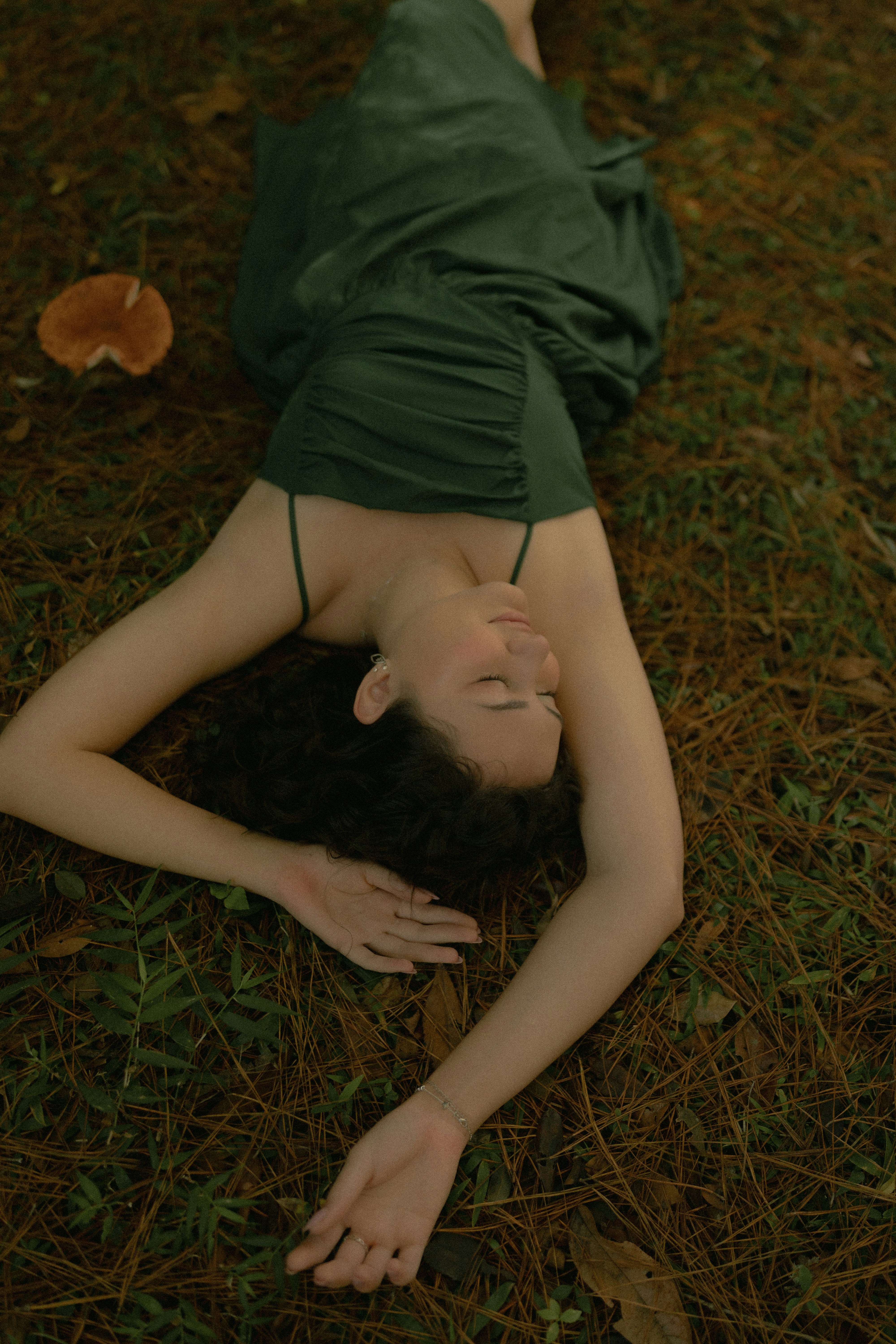 Relaxed Meadow Reverie: A Green Dress Amid Autumn Pines