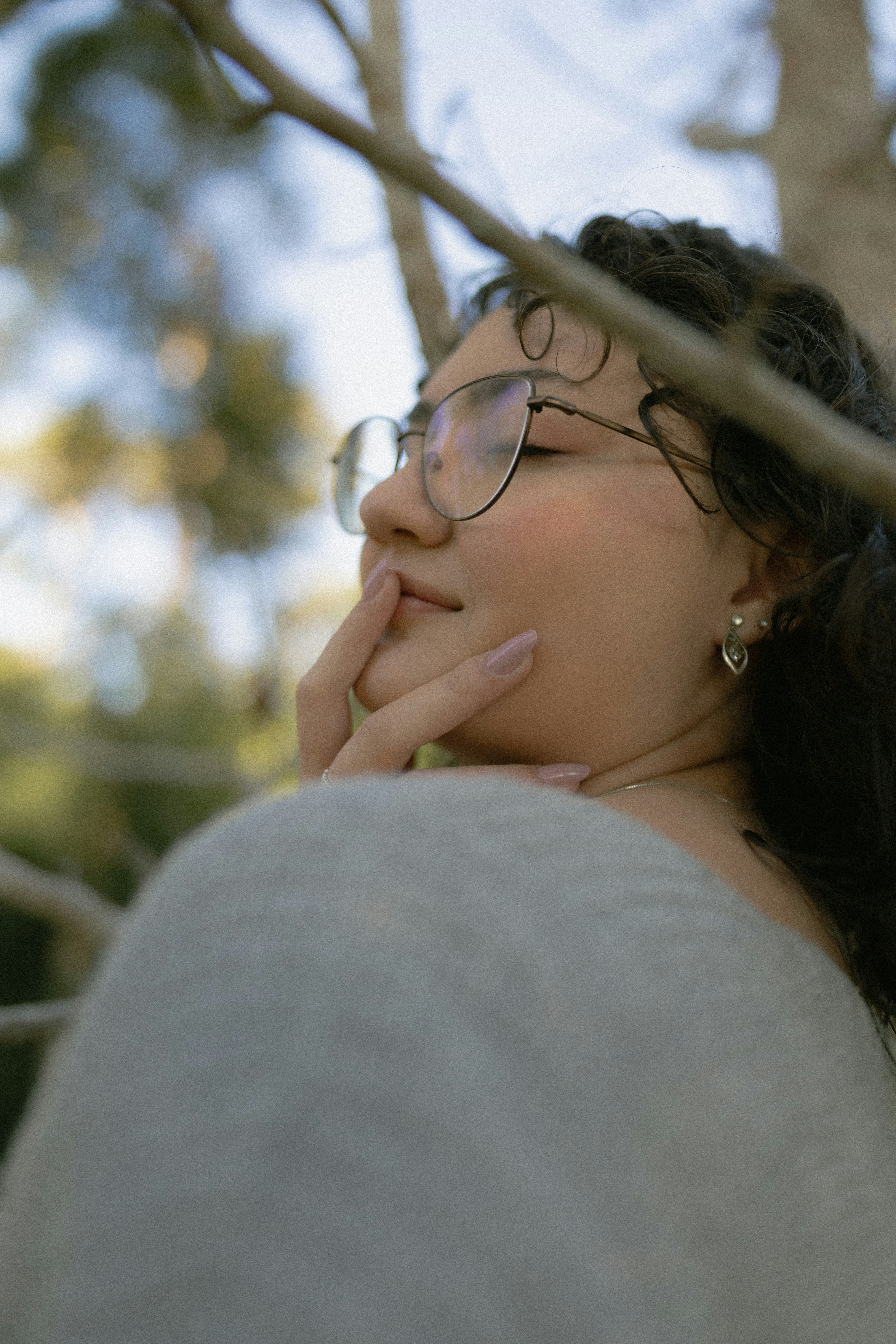 Glasses and Quiet Thought: A Portrait in Soft Focus