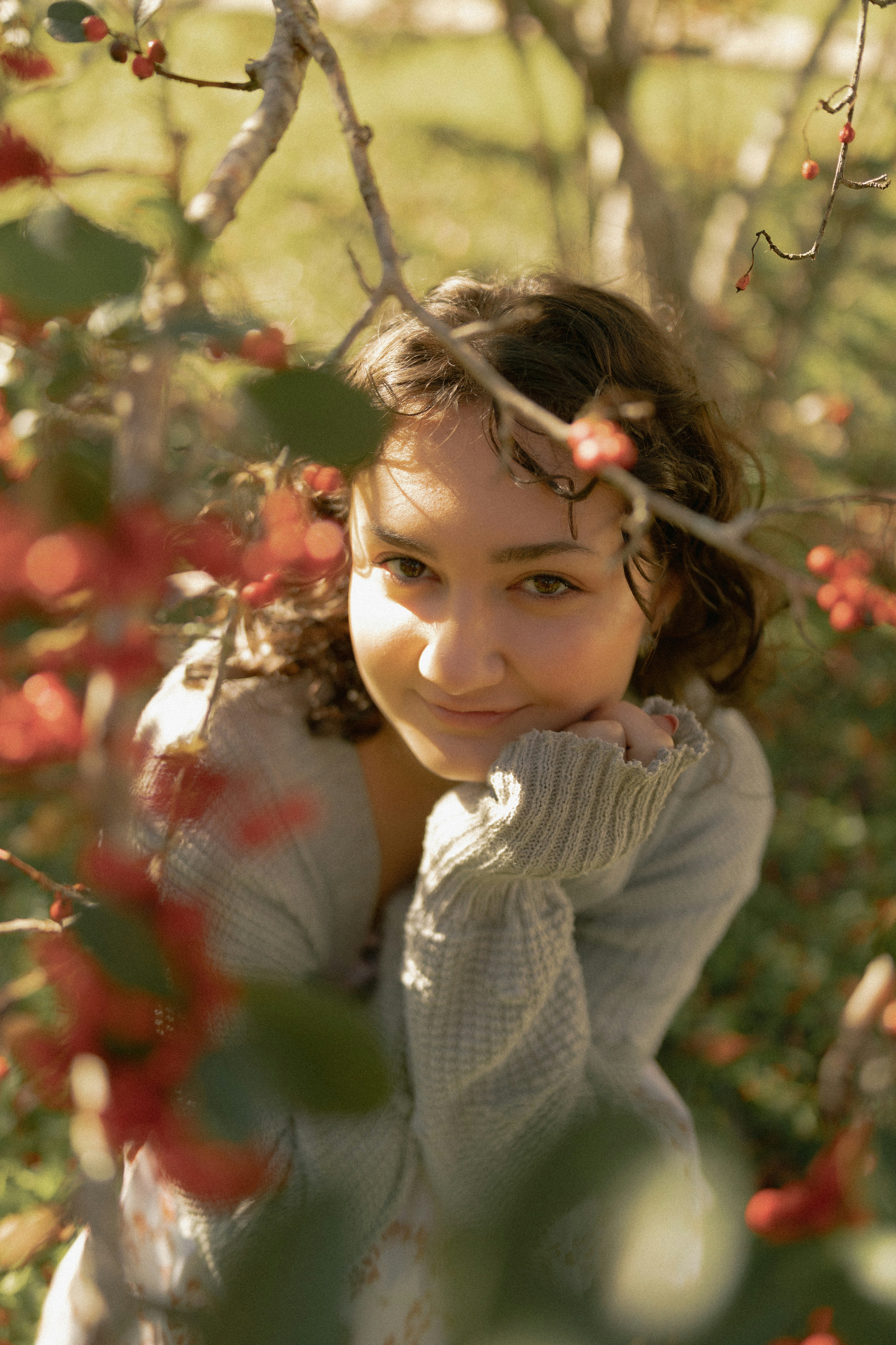 Soft-gaze Amid Red Berries: a Quiet Portrait