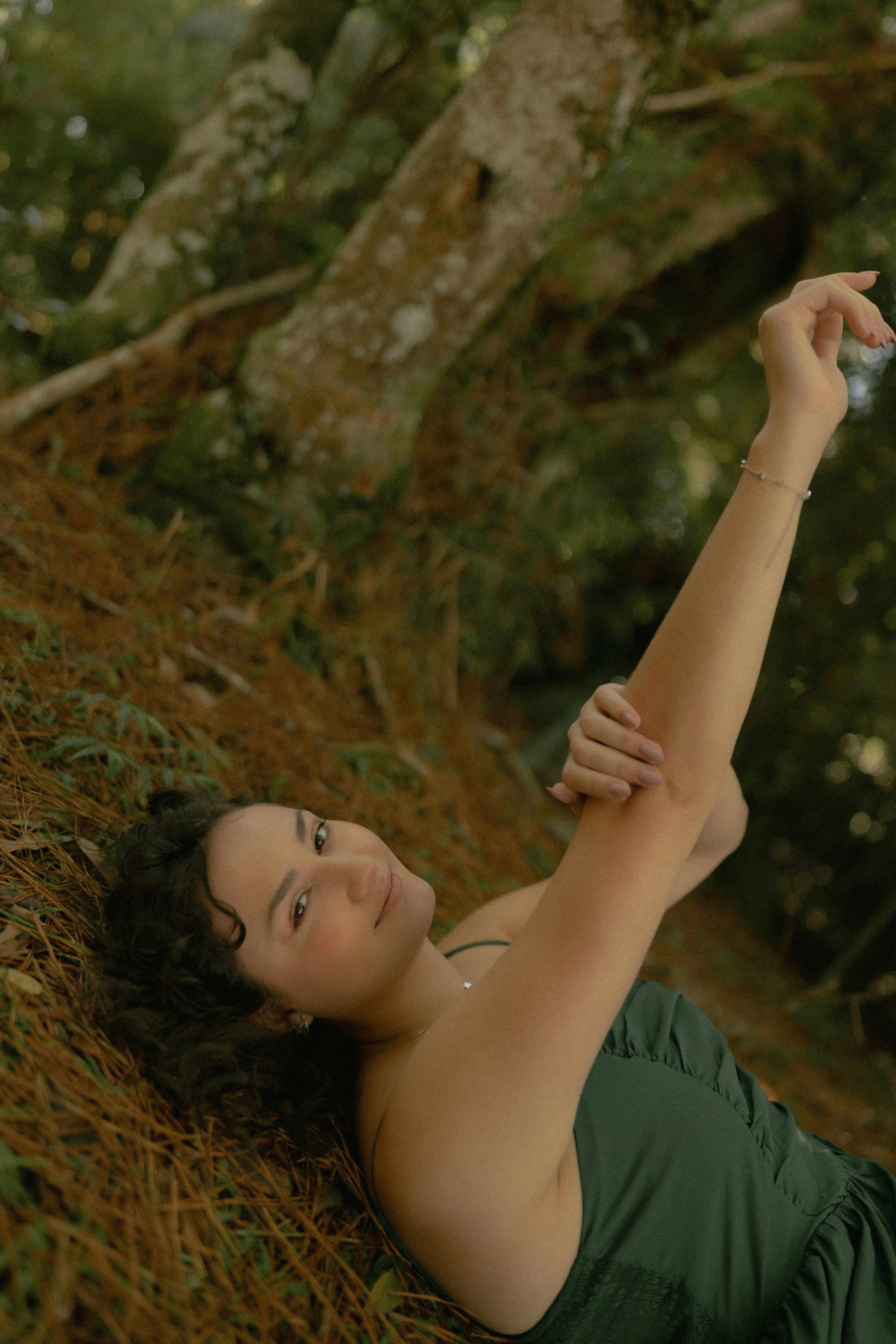 Green-draped Enchantment: A Sunlit Pose in the Pines