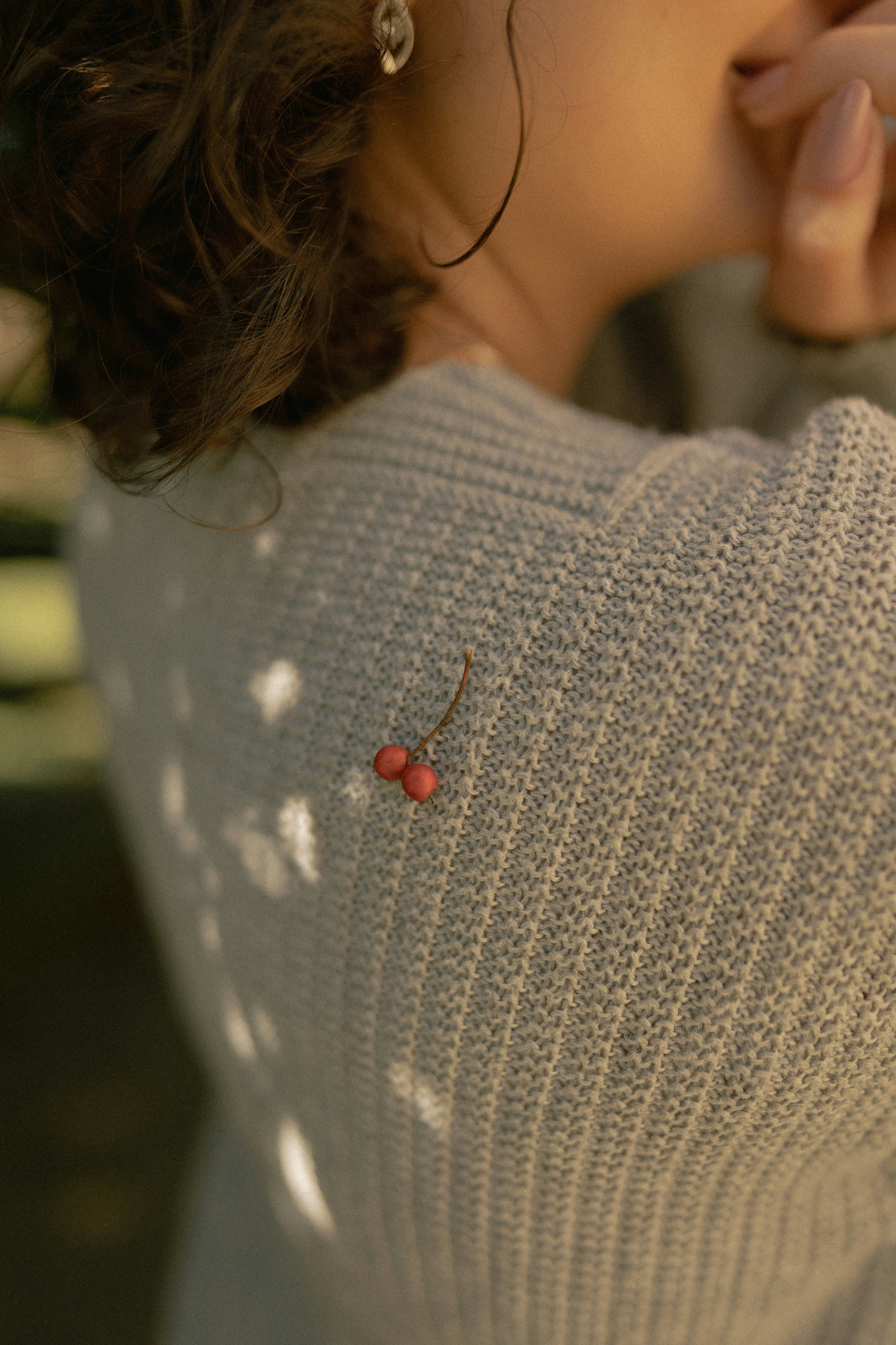 Cherry Stitches: Warm Light on a Knit Back