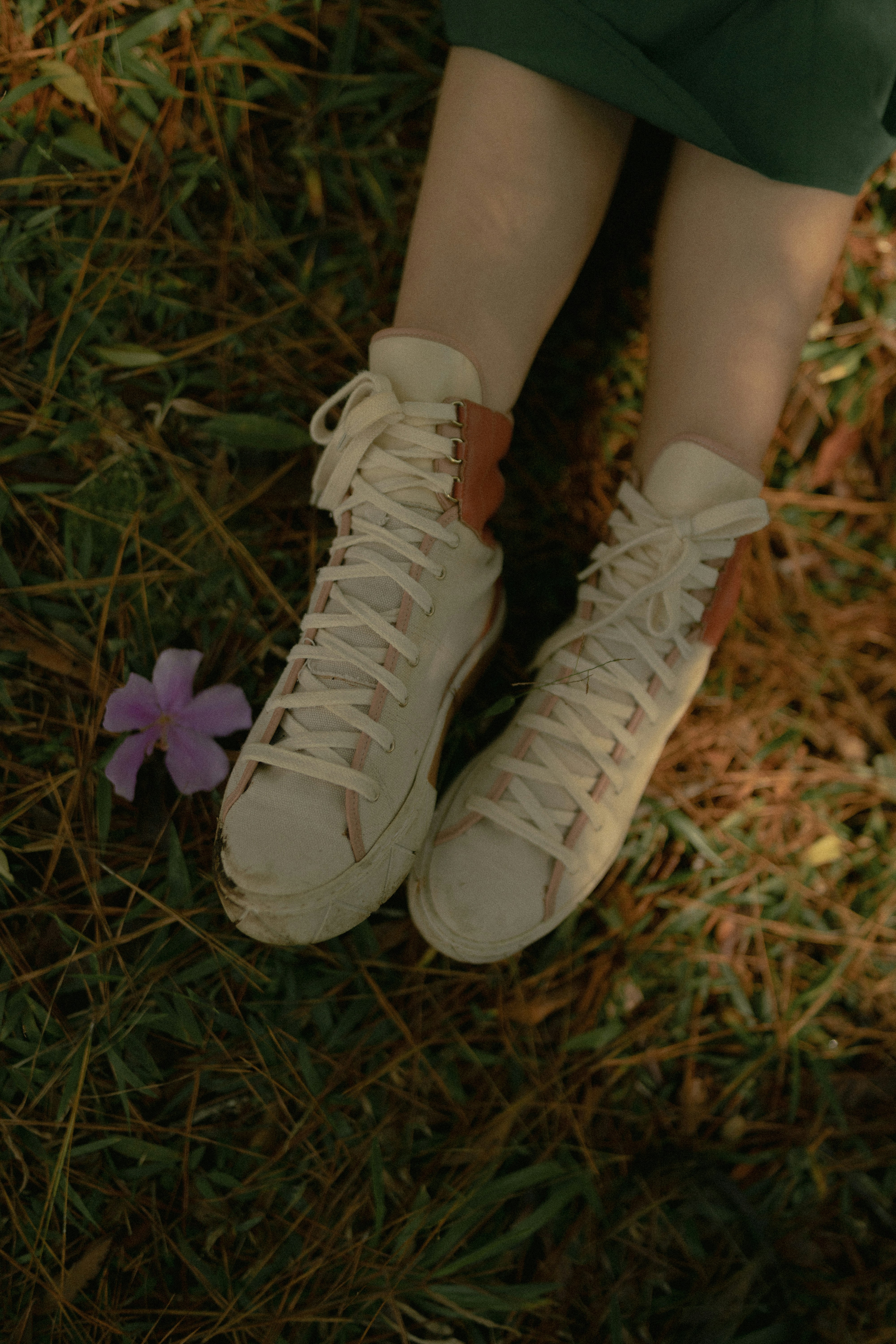 White High-Top Sneakers in Tall Grass with a Violet Bloom