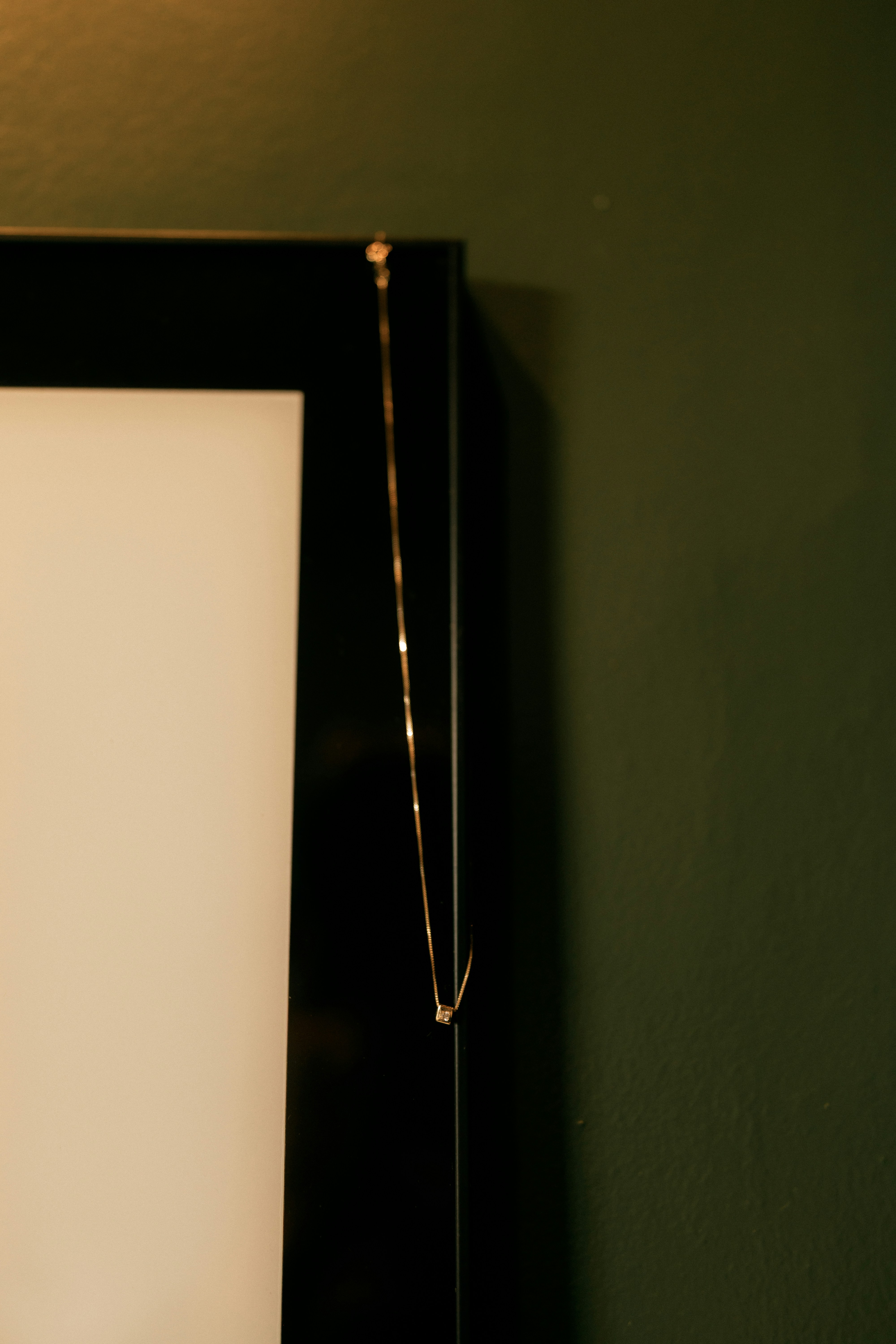 Golden Thread on a Dark Wall