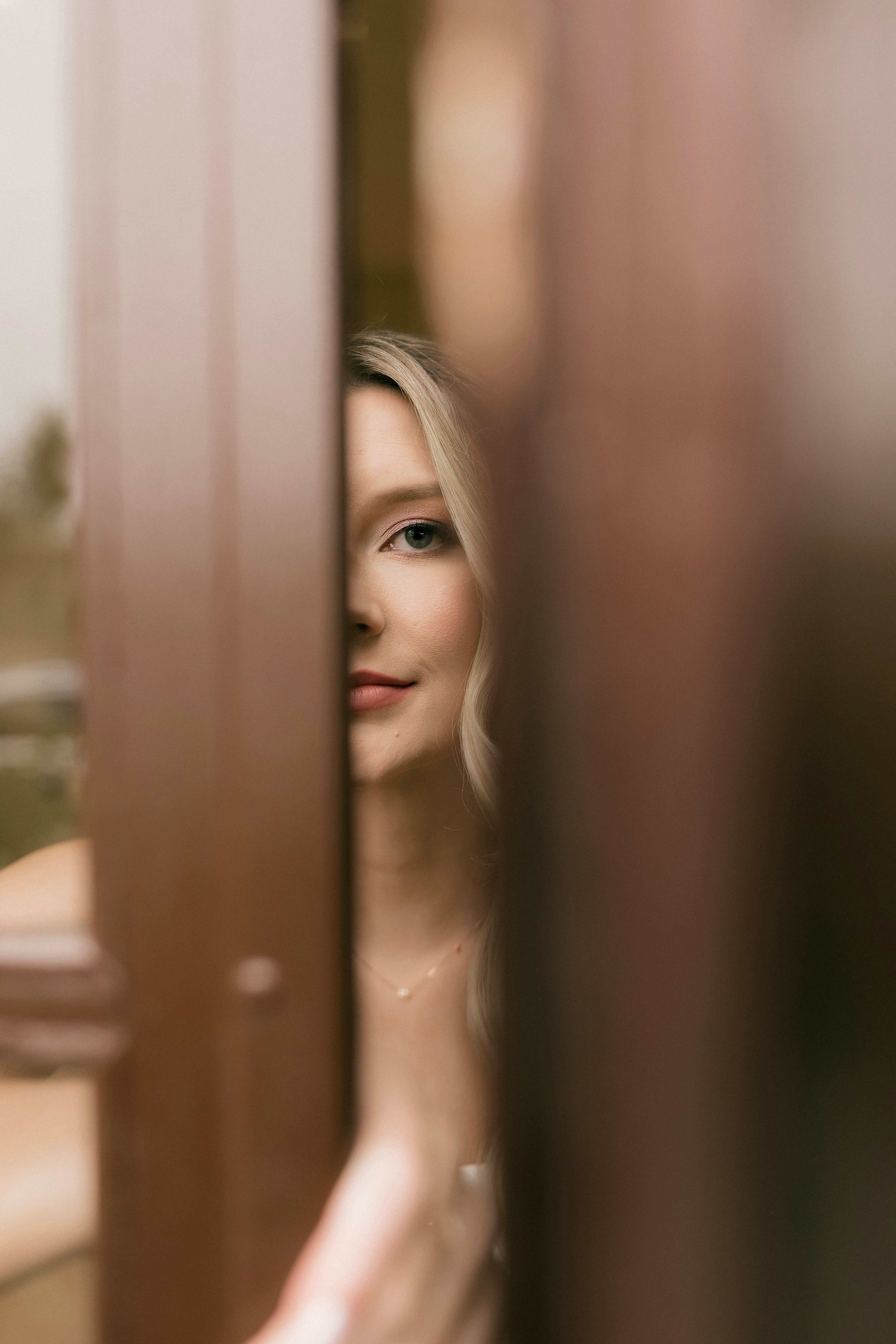 Pastel Quiet: A Face Framed by Narrow Gaps