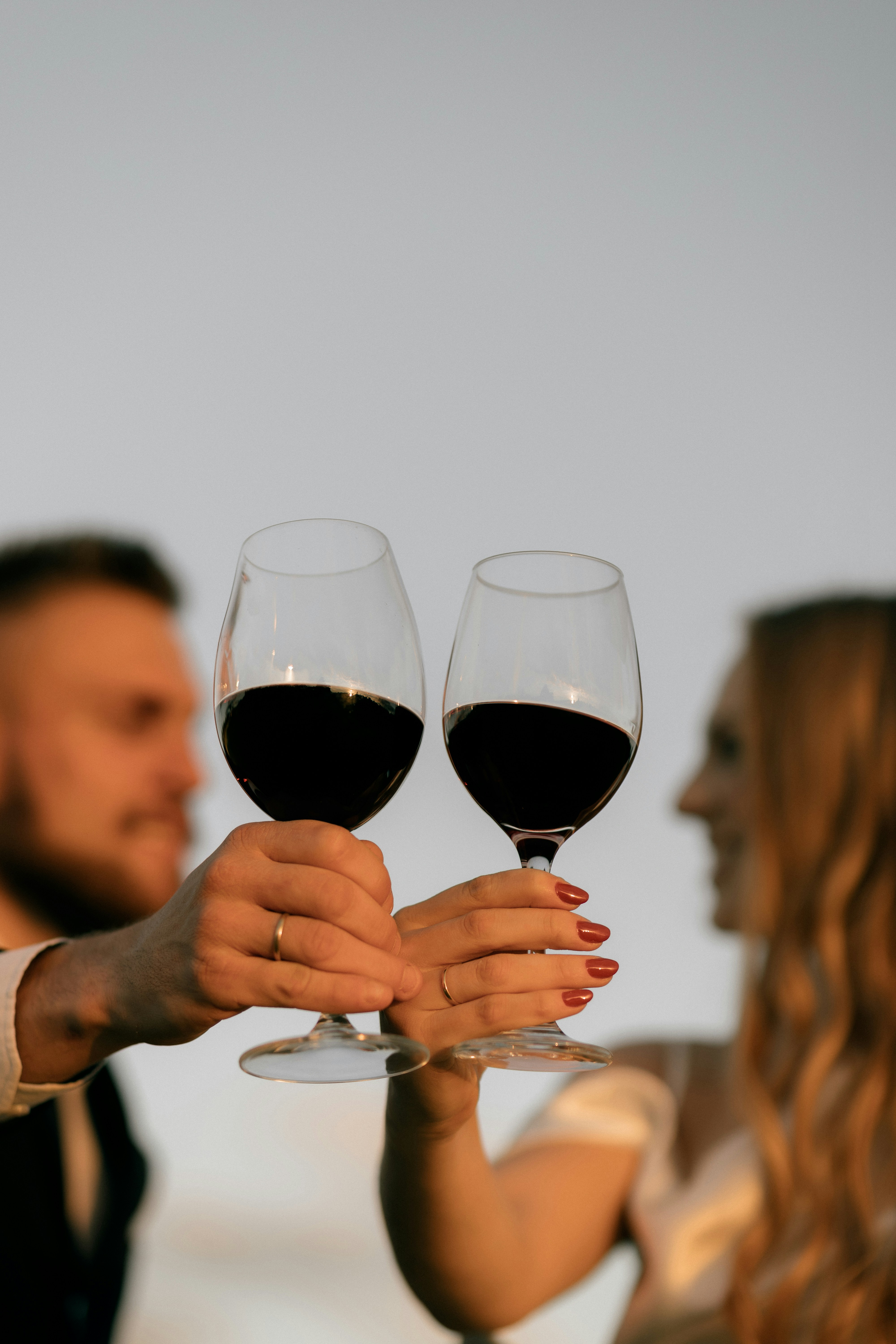 Toasting in Focus: Two Wine Glasses, Shared Moment