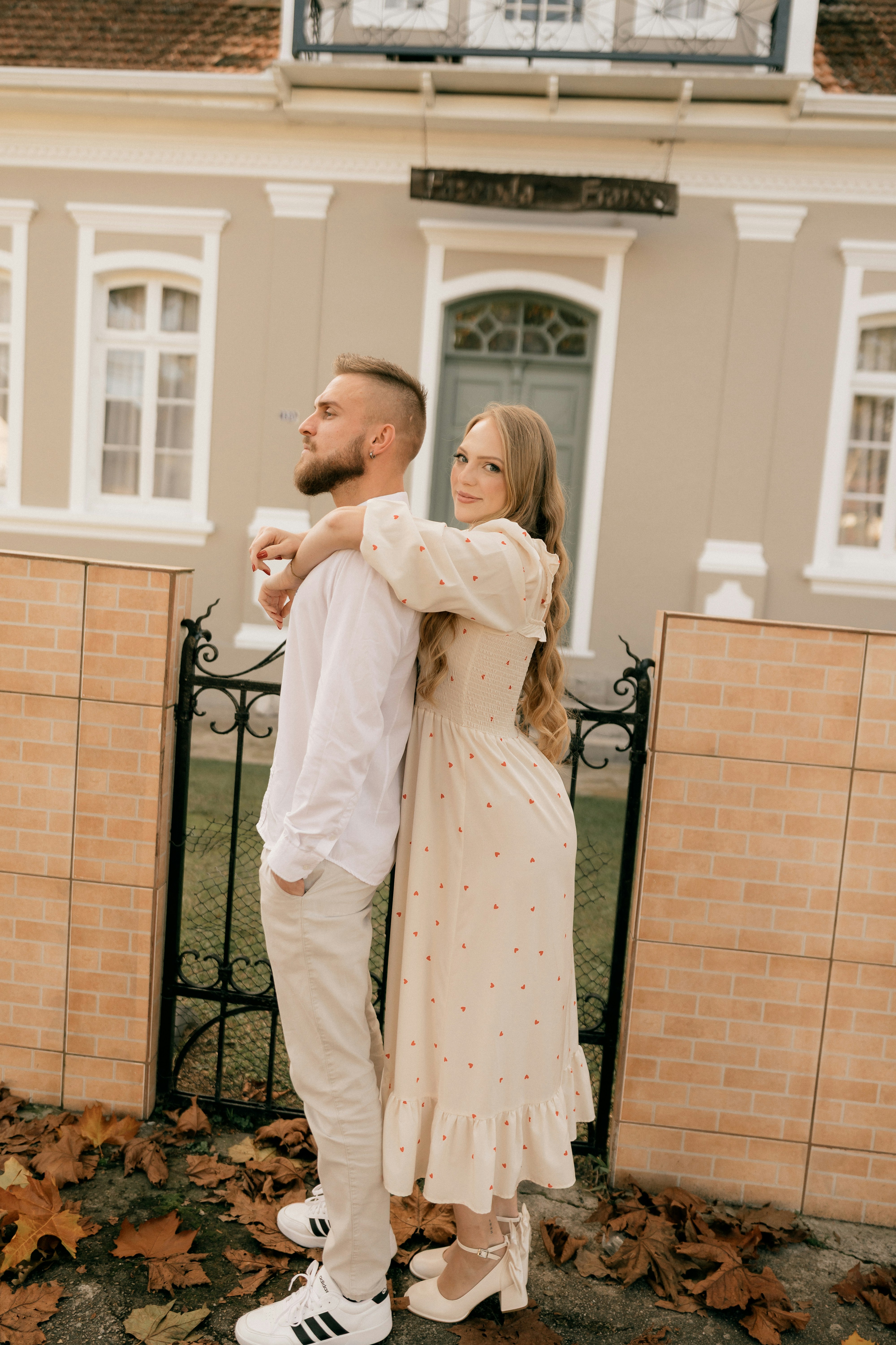 Couple Embraced by a Quiet Facade