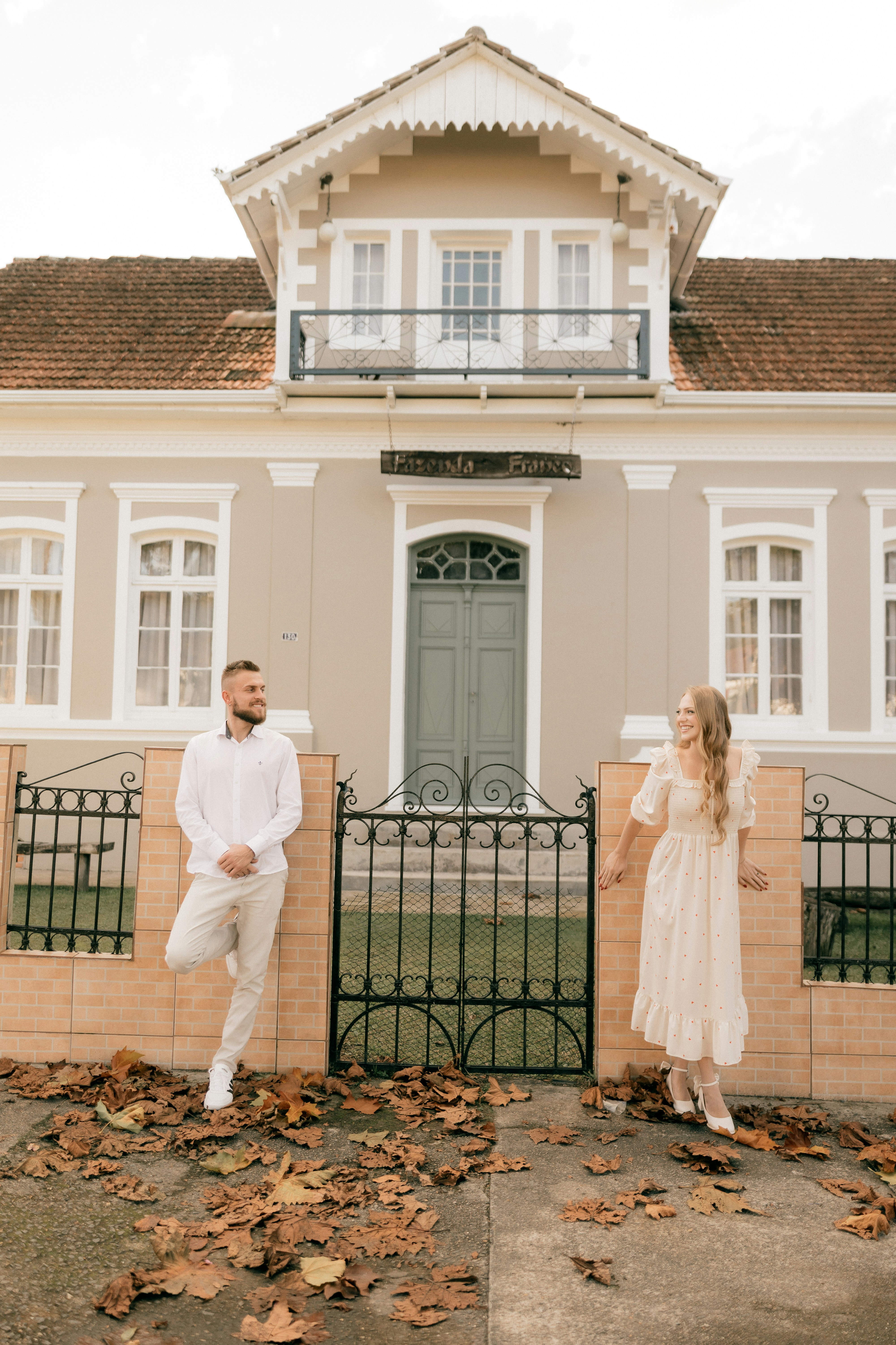 Couple at the Gatehouse: A Gentle Autumn Moment in a Classic Villa