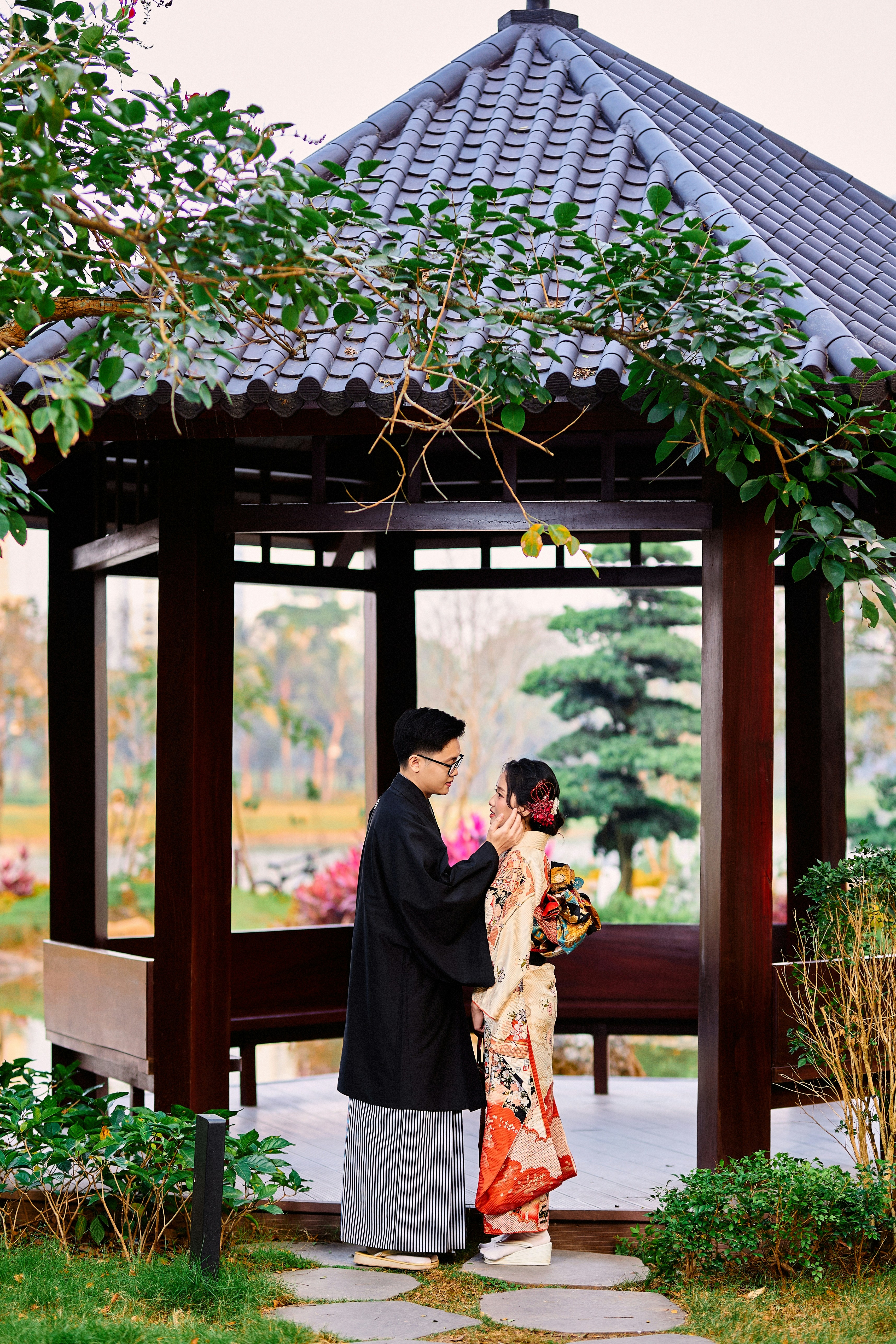 A joyful couple sharing a tender moment, smiling warmly at each other while taking a stroll outdoors. The image radiates genuine happiness, commitment, and the beautiful milestone of a long-lasting relationship.